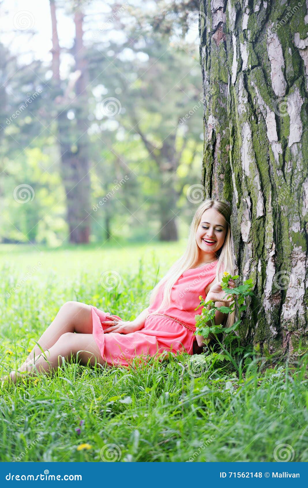 Woman sitting under a tree stock photo. Image of floral - 71562148