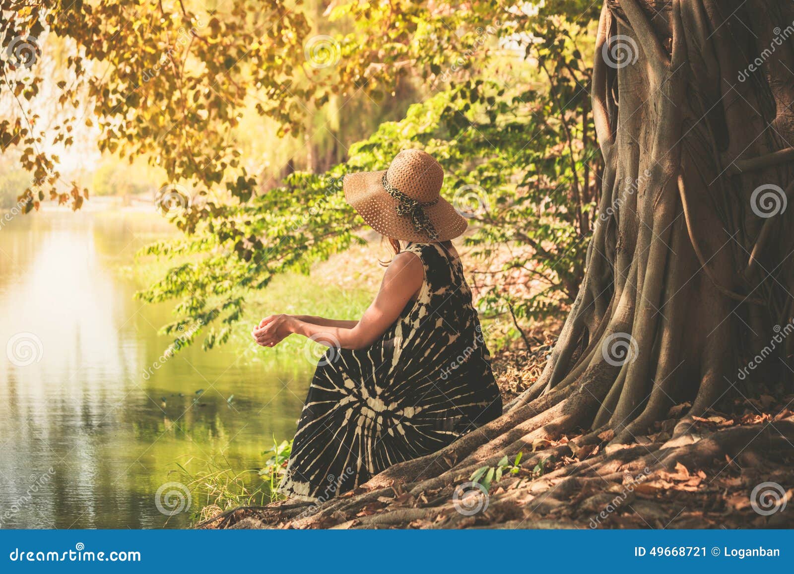 Woman Sitting Under Tree by the River Stock Image - Image of sitting ...