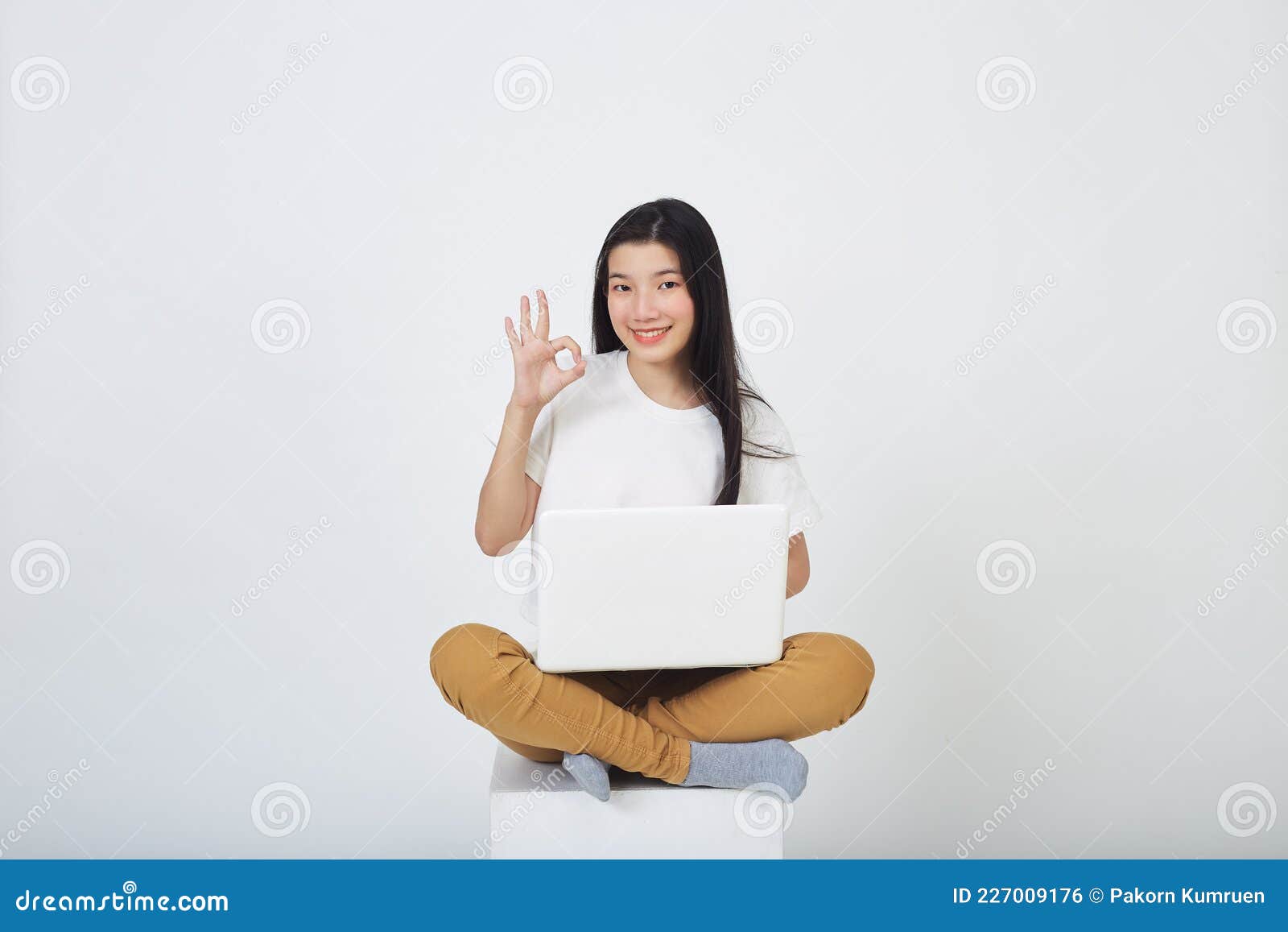 Woman Sitting Using Laptop Sitting on Gray Background Stock Photo ...