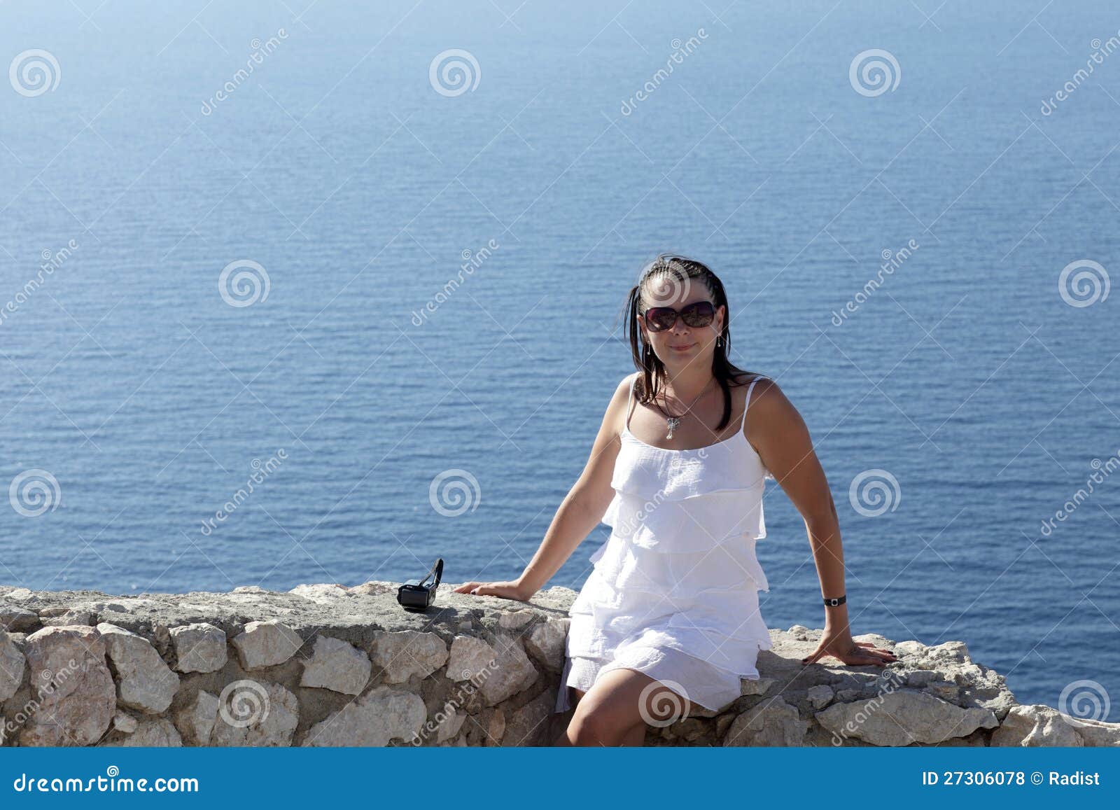 Woman Sitting on Wall of Castle Stock Photo - Image of portrait, cliff ...