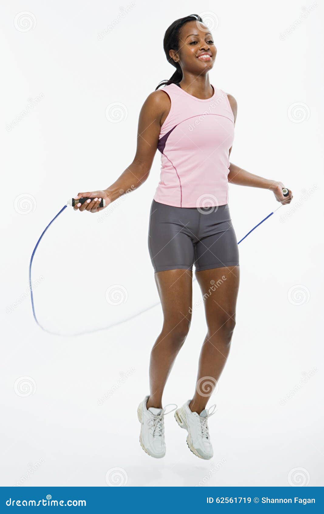 Woman With Skipping Rope. Stock Photography | CartoonDealer.com #91310690
