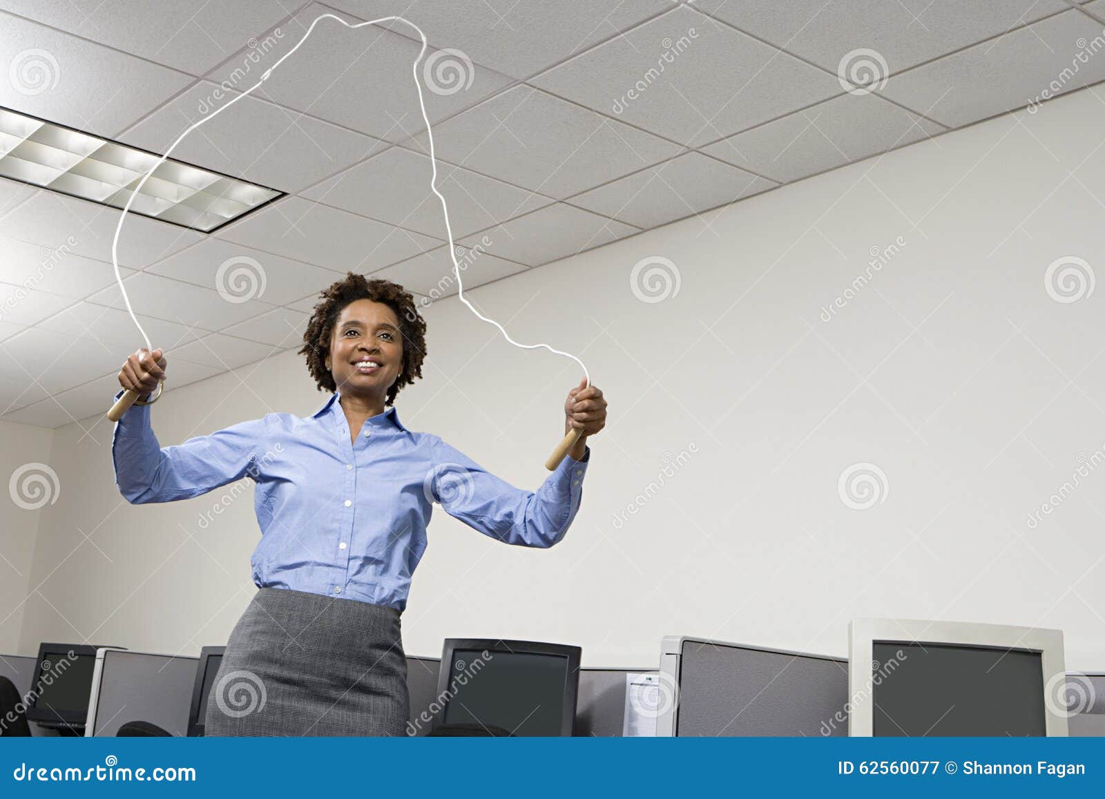 Woman skipping in office stock image. Image of interior - 62560077