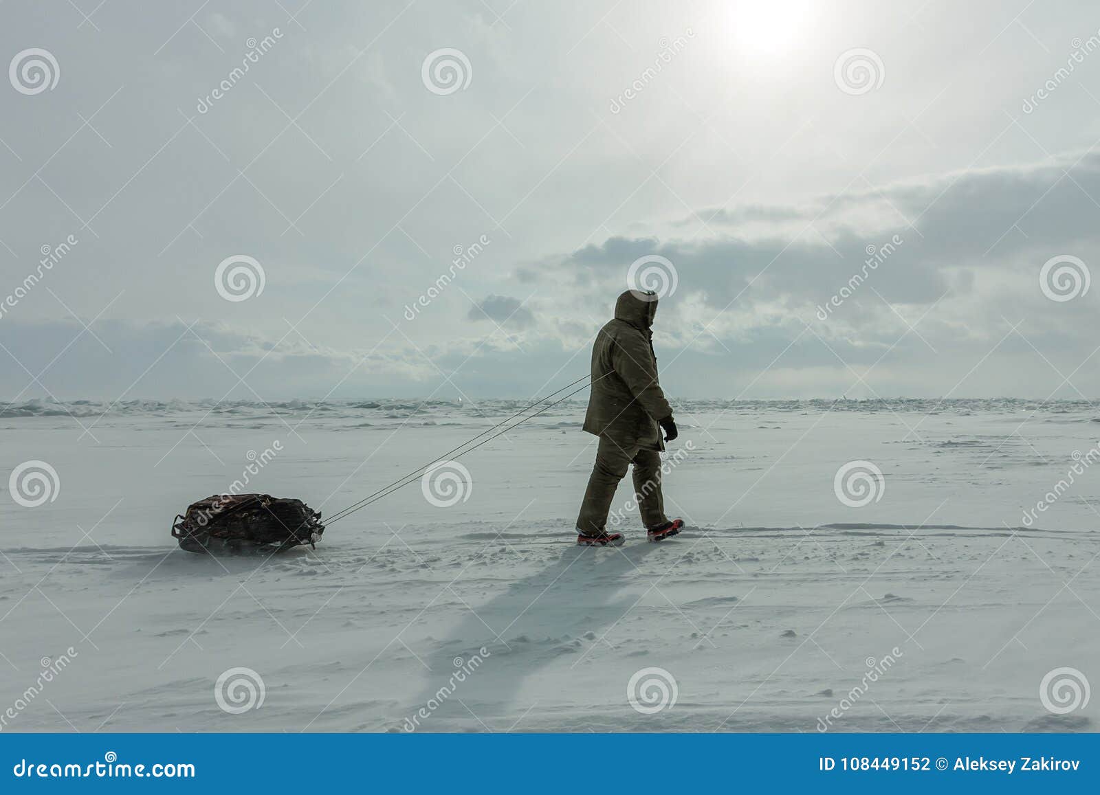Woman with a Sledge Walk is on the Ice of Lake Baikal Stock Photo ...