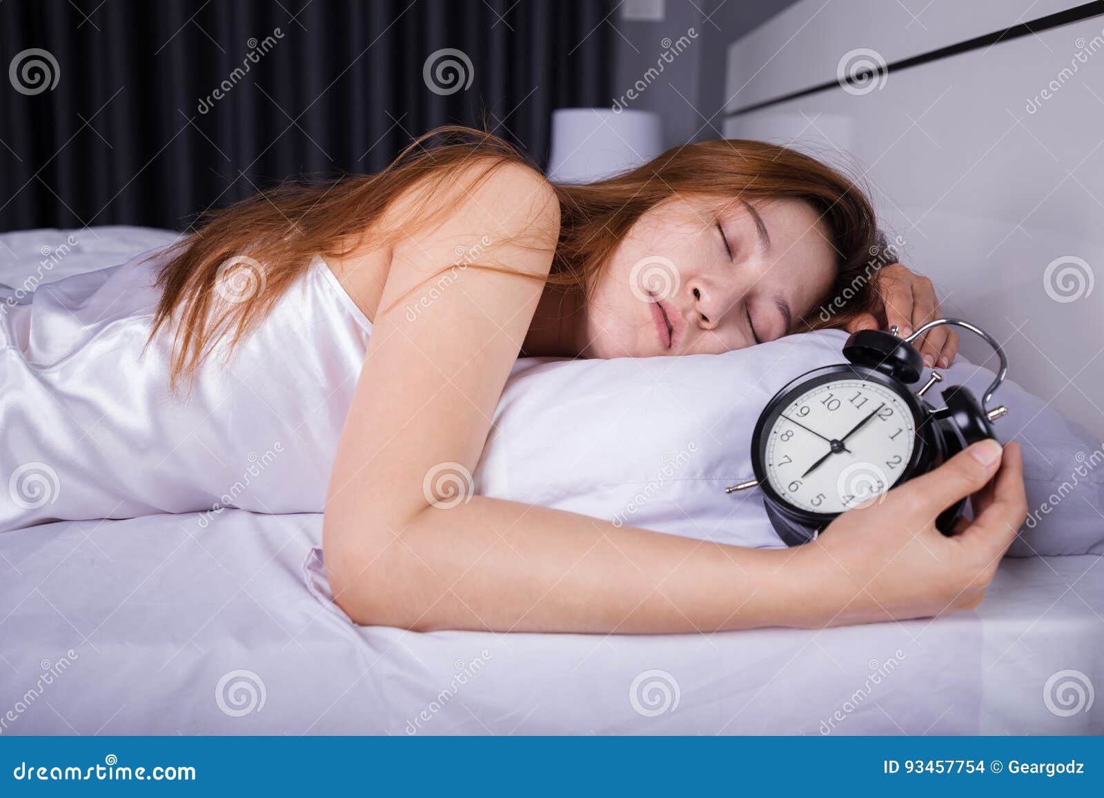 Woman Sleeping on Bed with Clock Show 6 O`clock Stock Photo - Image of ...