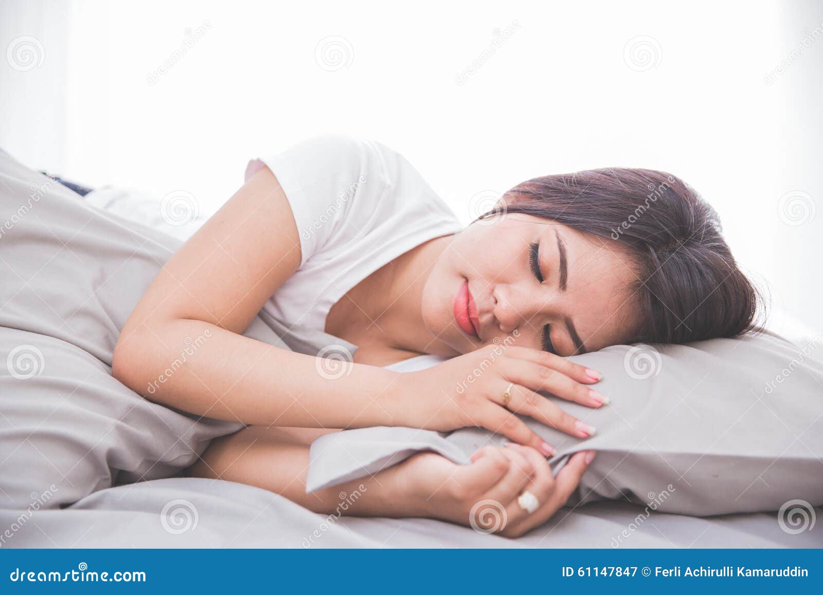 Woman sleeping on a bed stock image. Image of people - 61147847