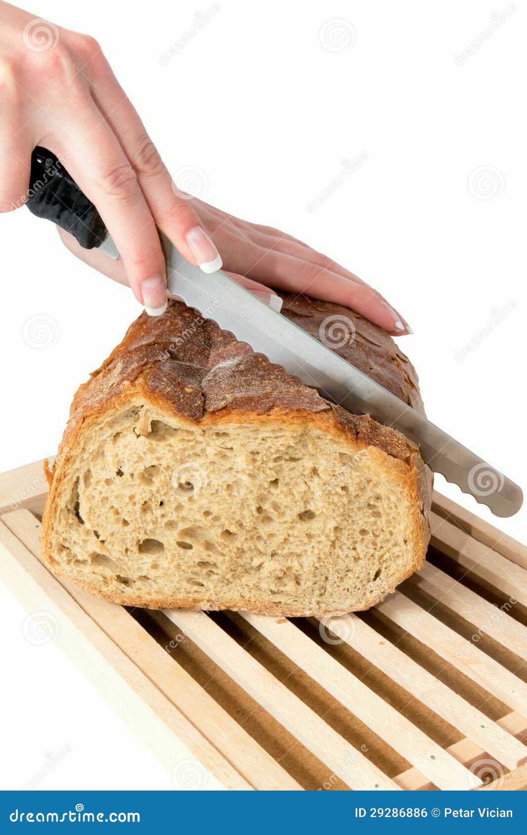 Woman Slicing Bread Royalty Free Stock Image - Image: 29286886