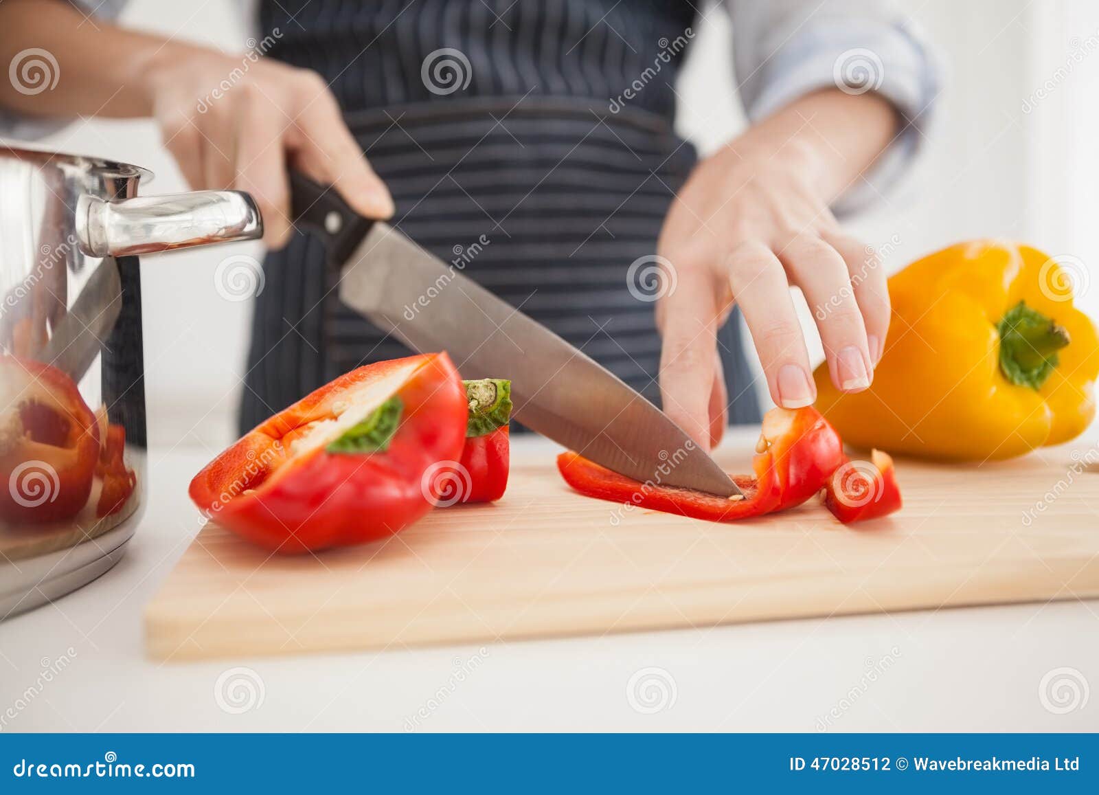 Woman Slicing Up Red Pepper Stock Photo - Image of apartment, indoors ...