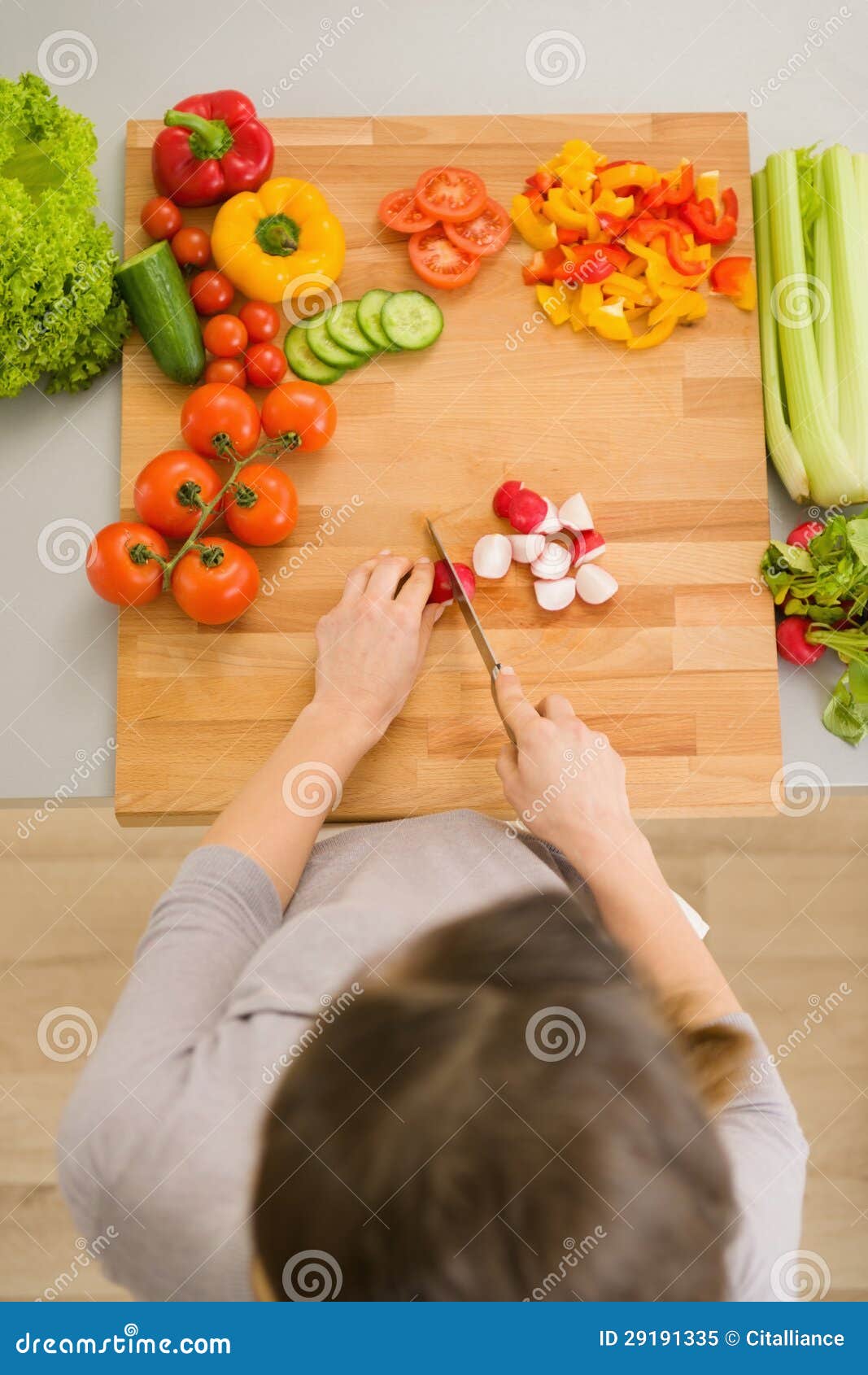 Woman Slicing Vegetables on Cutting Board Stock Image - Image of ...
