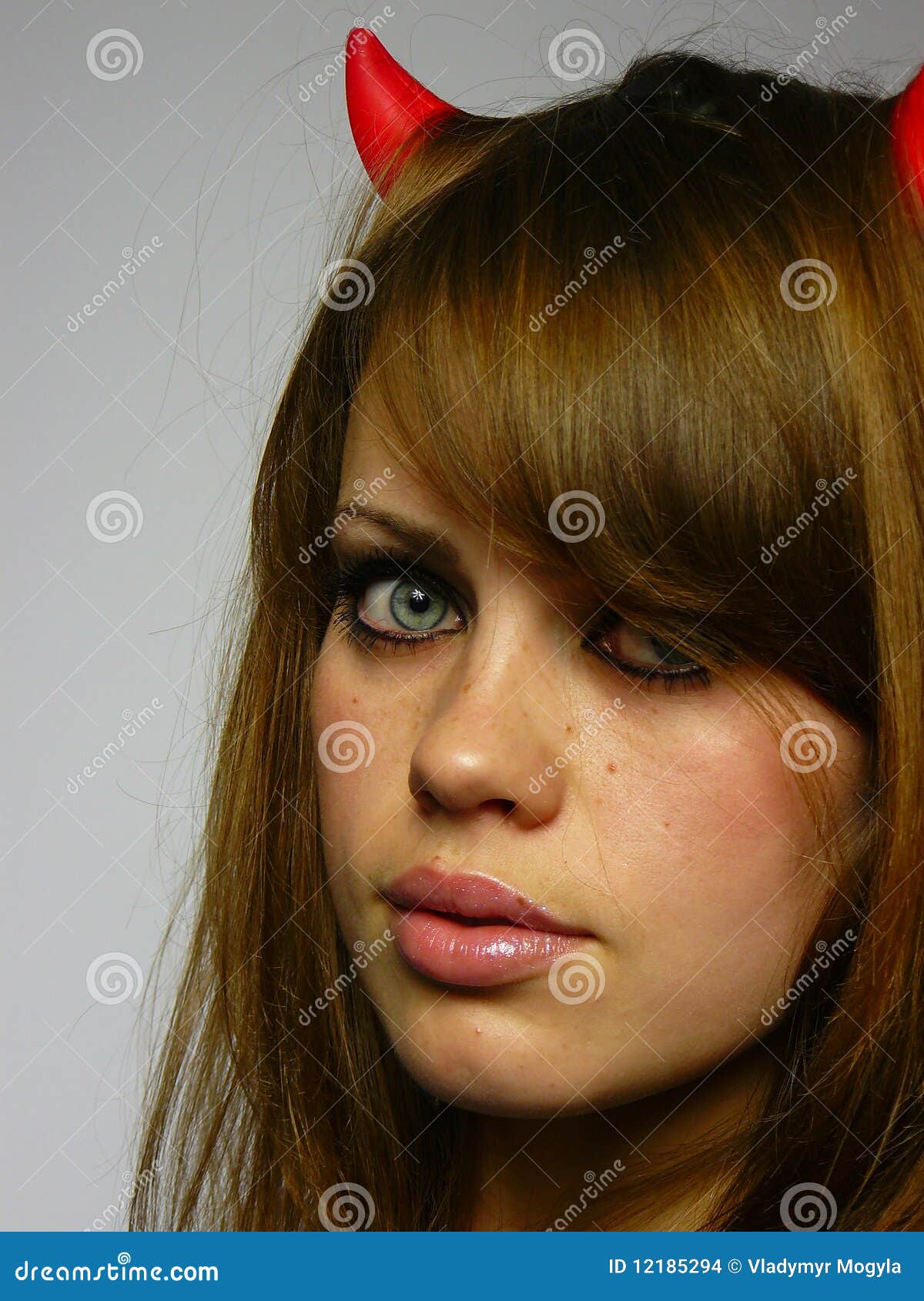 Woman With Small Horns On A Head Stock Photo - Image: 12185294