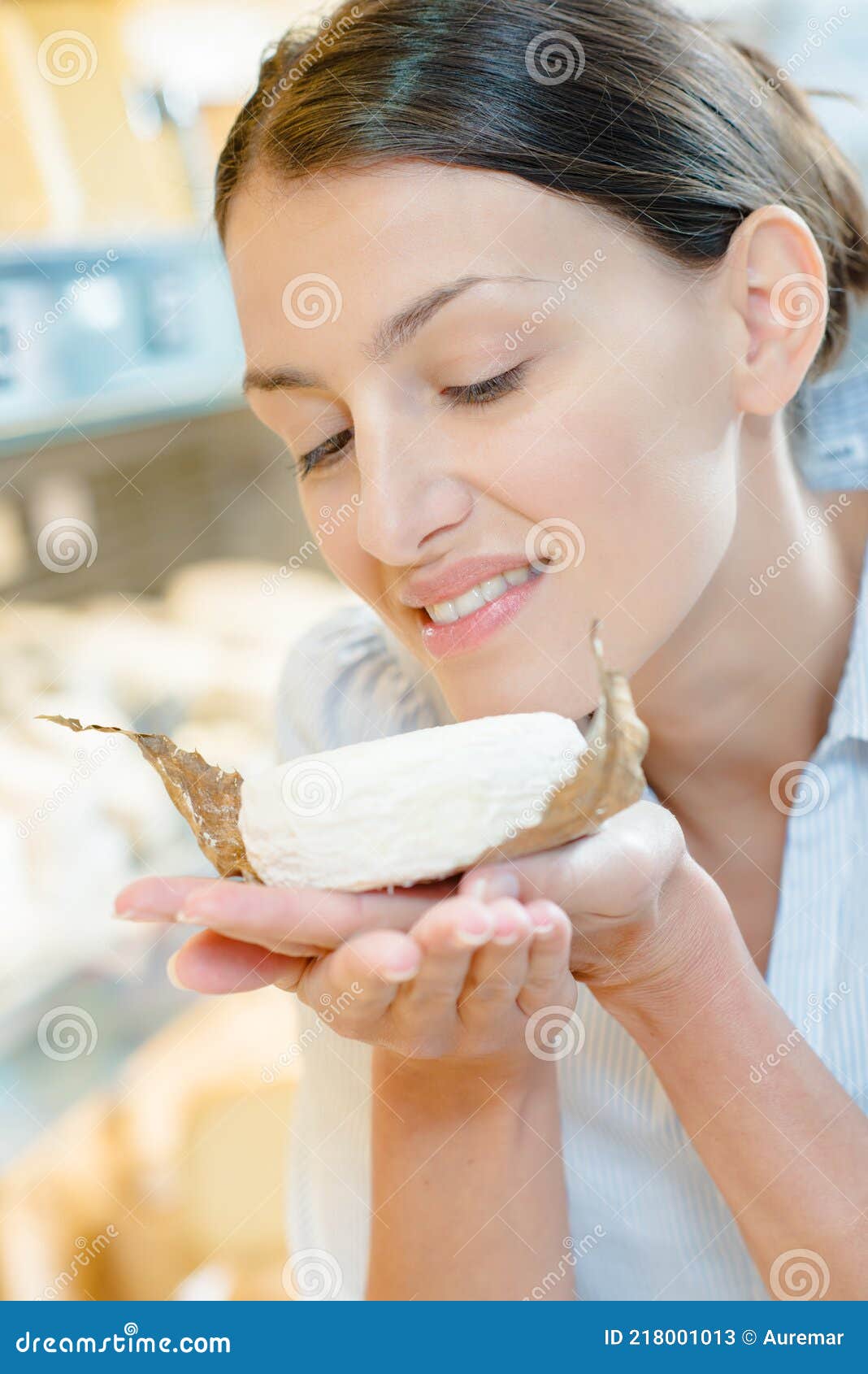 Woman and smell cheese stock image. Image of fine, premium - 218001013