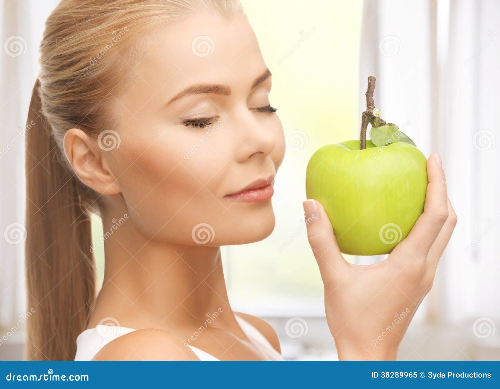 Woman smelling apple stock image. Image of beautiful - 38289965