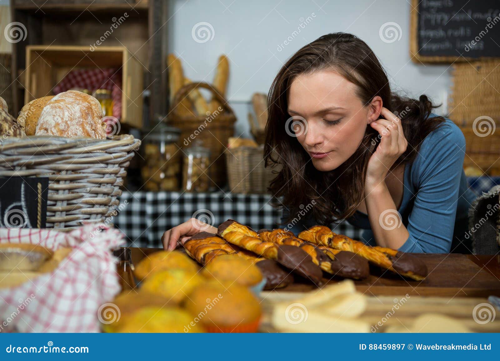 Woman Smelling Bread at Bakery Counter Stock Image - Image of retail ...