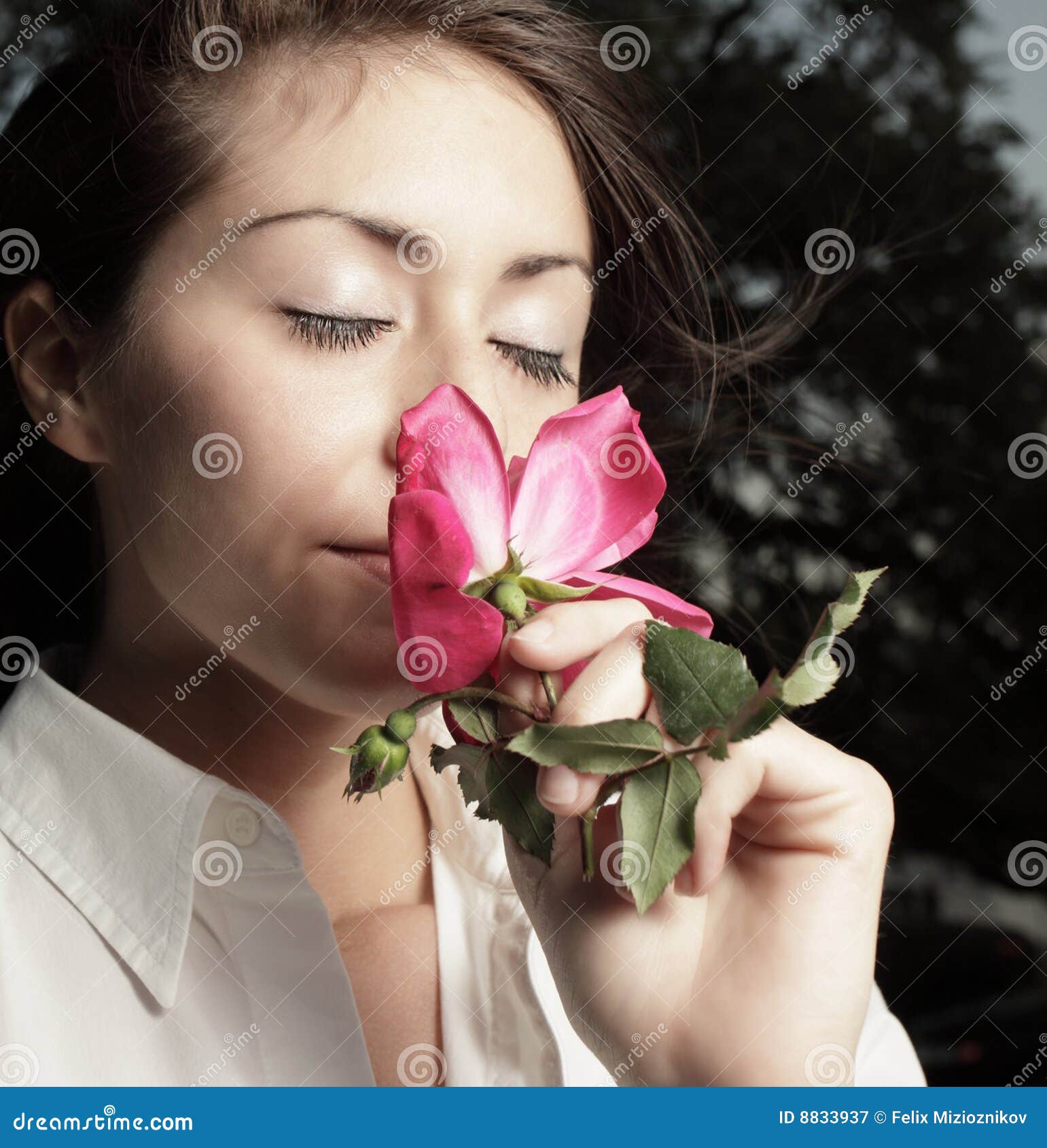 Woman smelling a flower stock image. Image of person, sniffing - 8833937