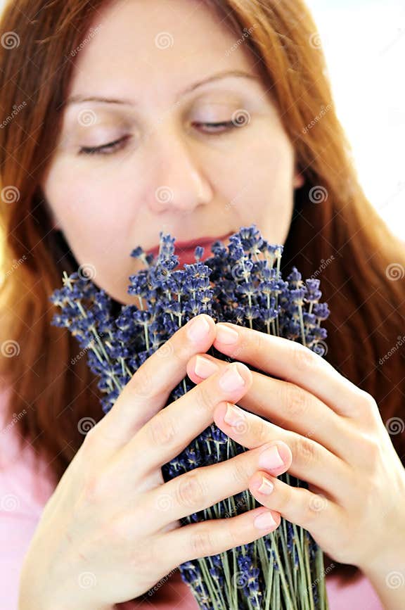 Woman smelling lavender stock image. Image of closeup - 5358541
