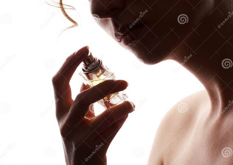 Woman smelling perfume stock photo. Image of cosmetics - 5357598