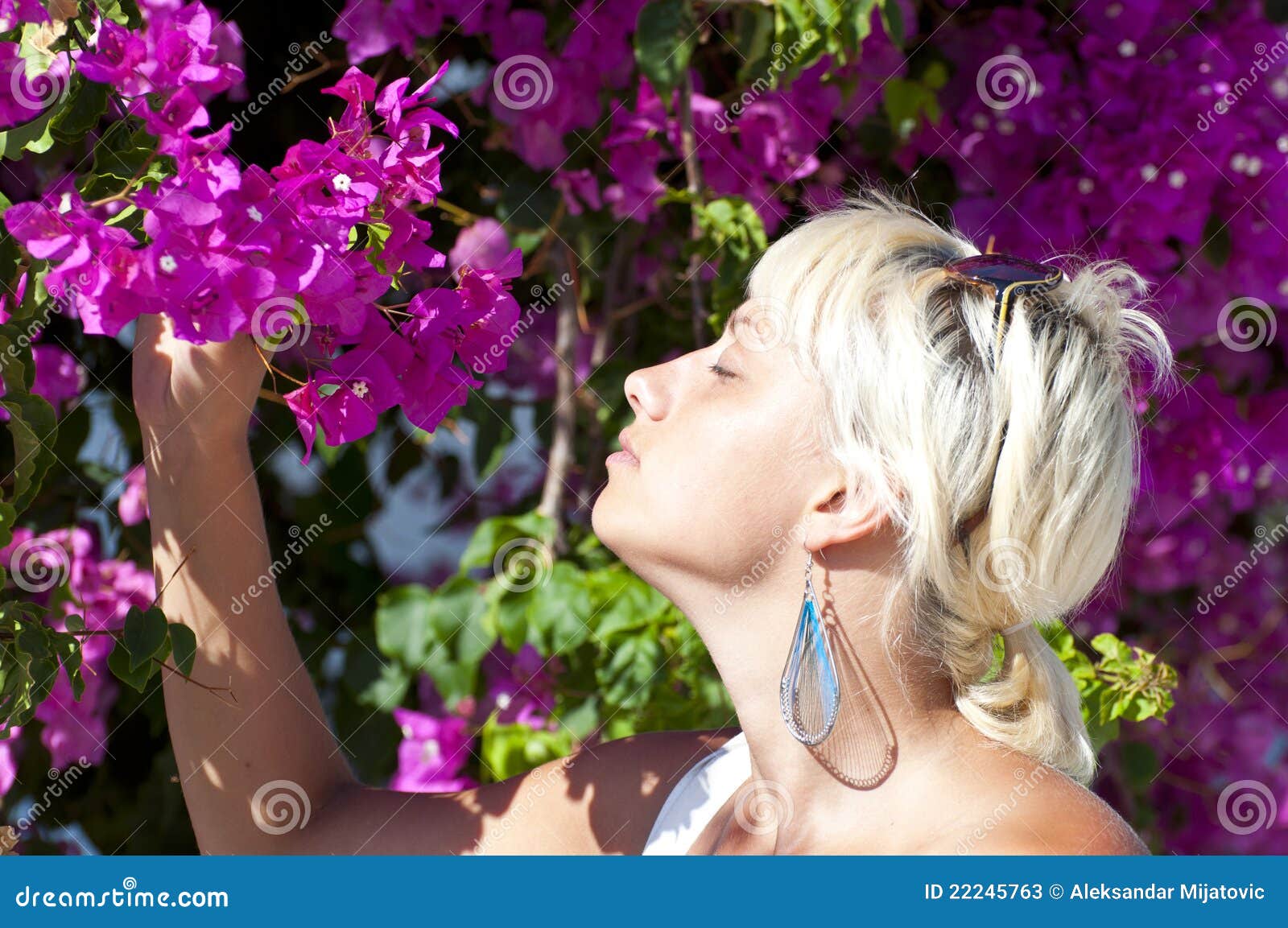 Woman Smelling Pink Flowers Stock Image - Image of fantasy, enjoy: 22245763