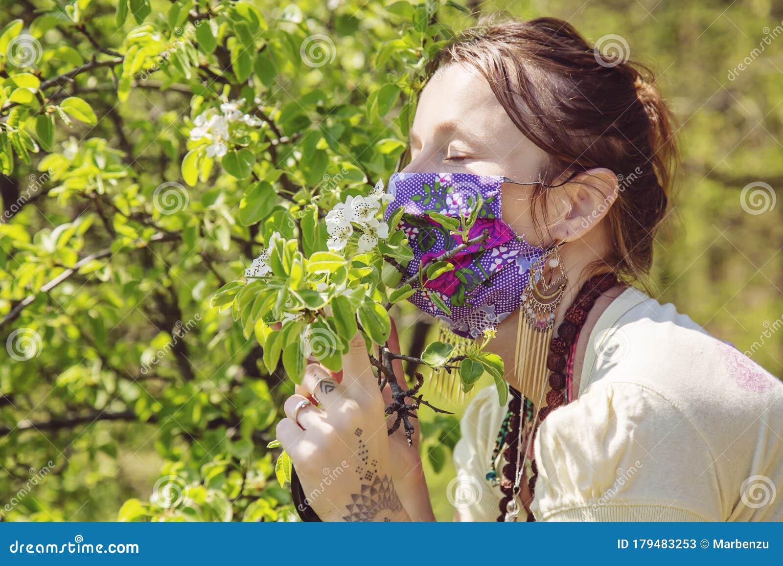 Woman Smelling Spring Blossoms in the Nature with Protective Stock ...