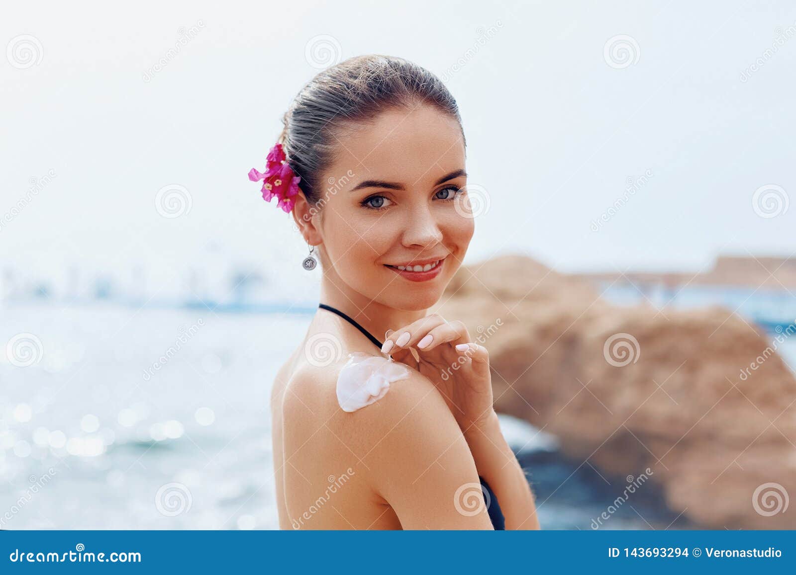 Woman Smile Applying Sunscreen Creme On Tanned Shoulder Skincare Body