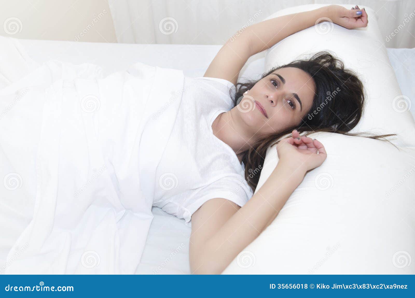 Woman smiling in bed stock photo. Image of resting, pillow - 35656018