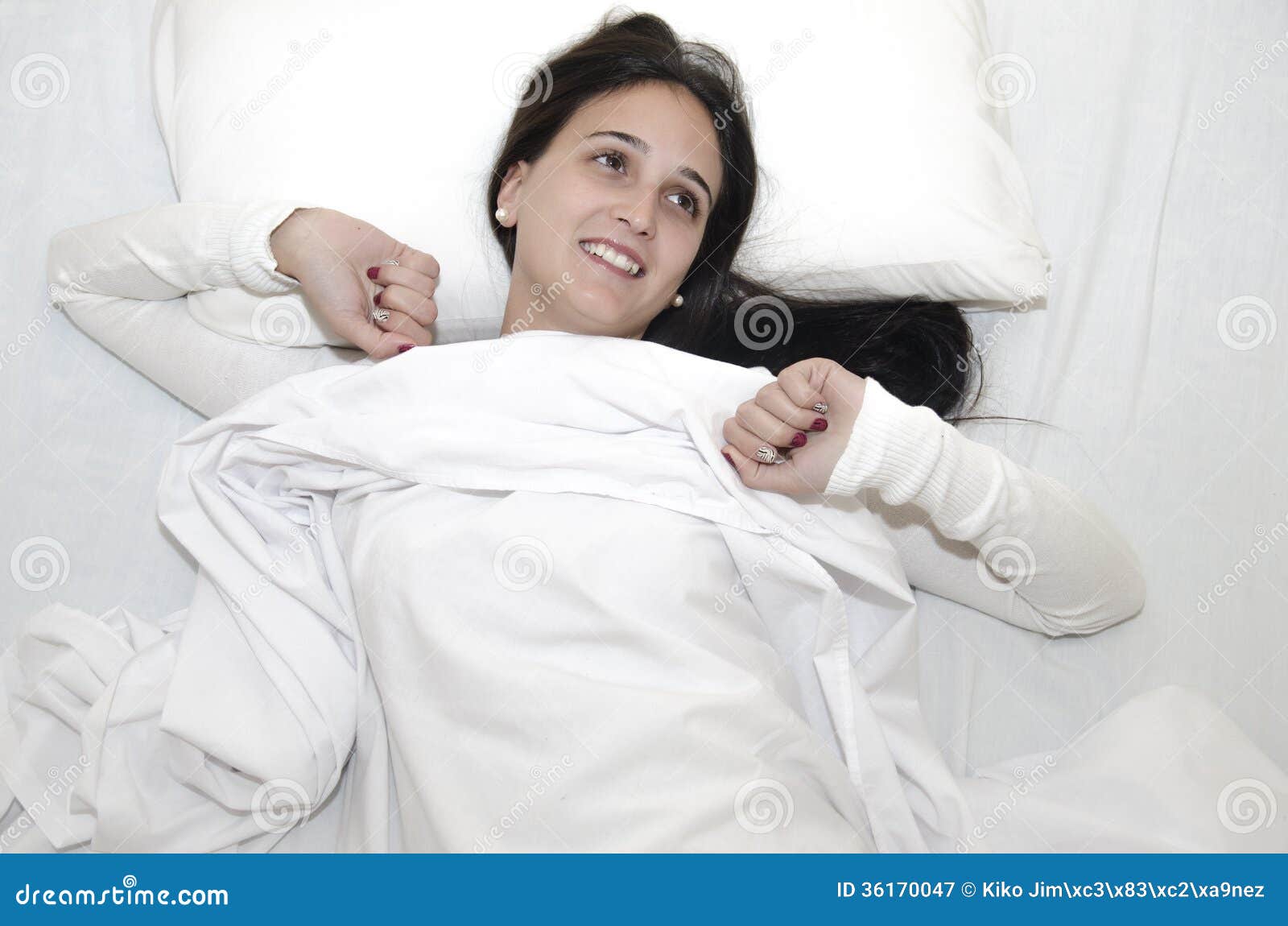 Woman smiling in bed stock image. Image of happy, beautiful - 36170047