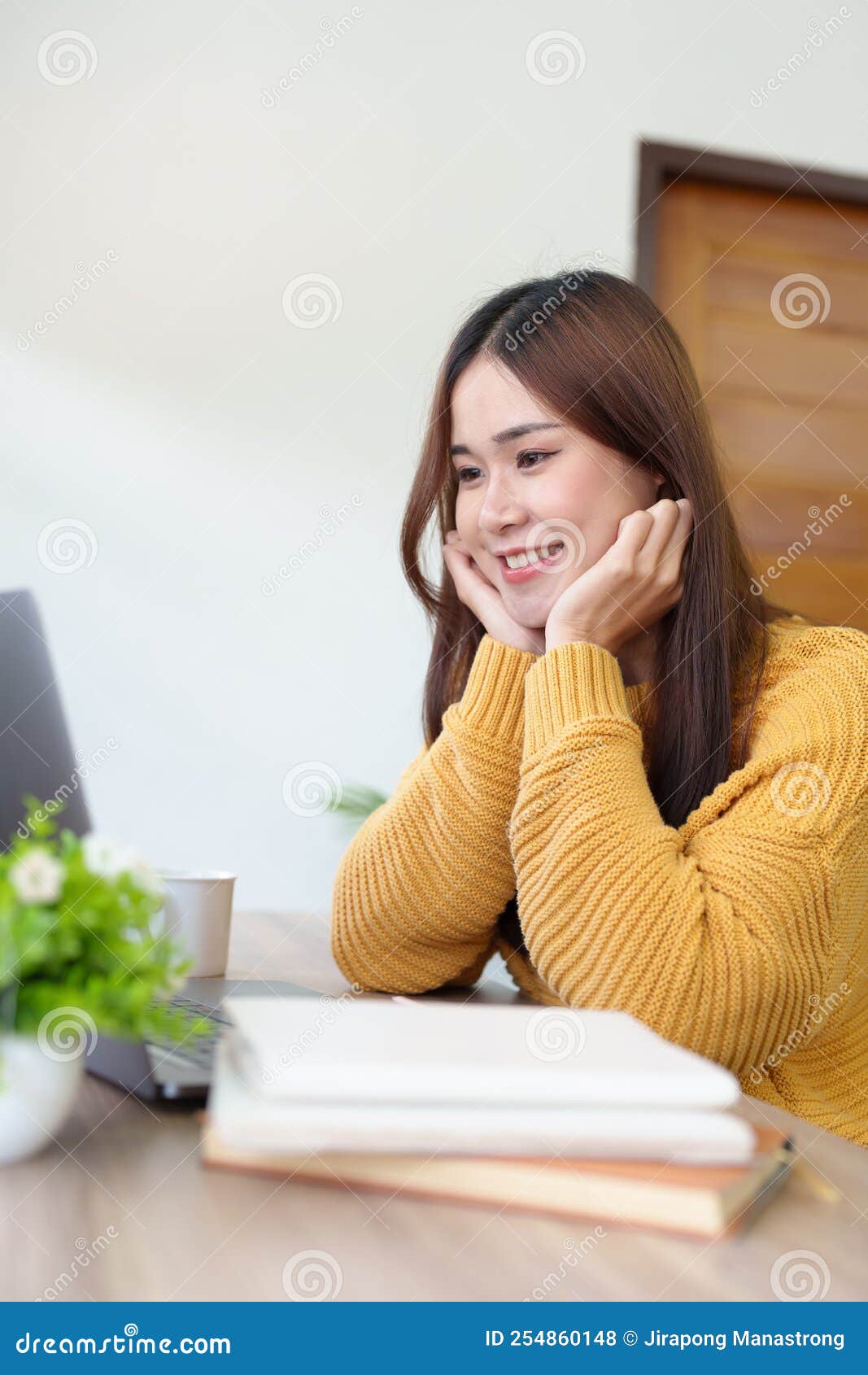 Woman Smiling Happily while Using Computer at Home Stock Photo - Image ...