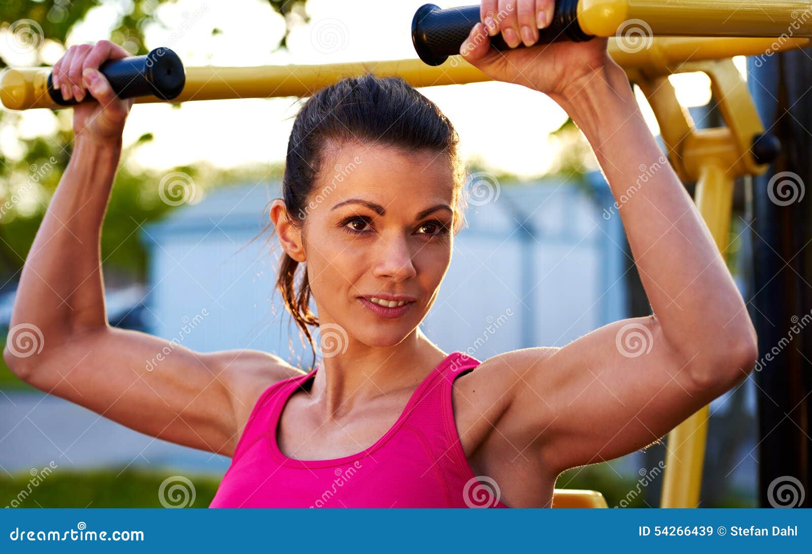 Woman Smiling while Lifting Weights Stock Image - Image of athletic ...