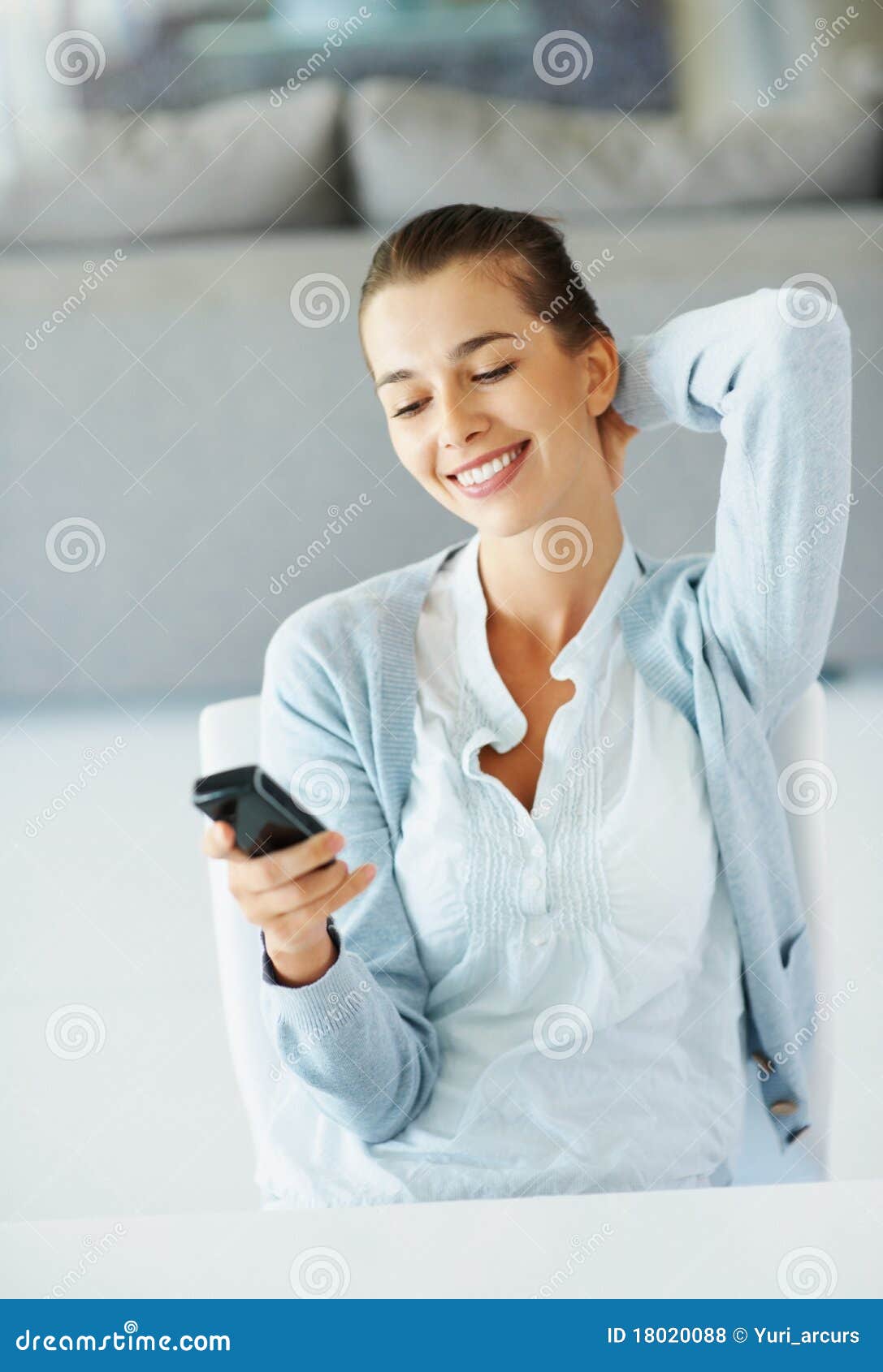 Woman Smiling while Reading Phone Text Stock Photo - Image of happiness ...