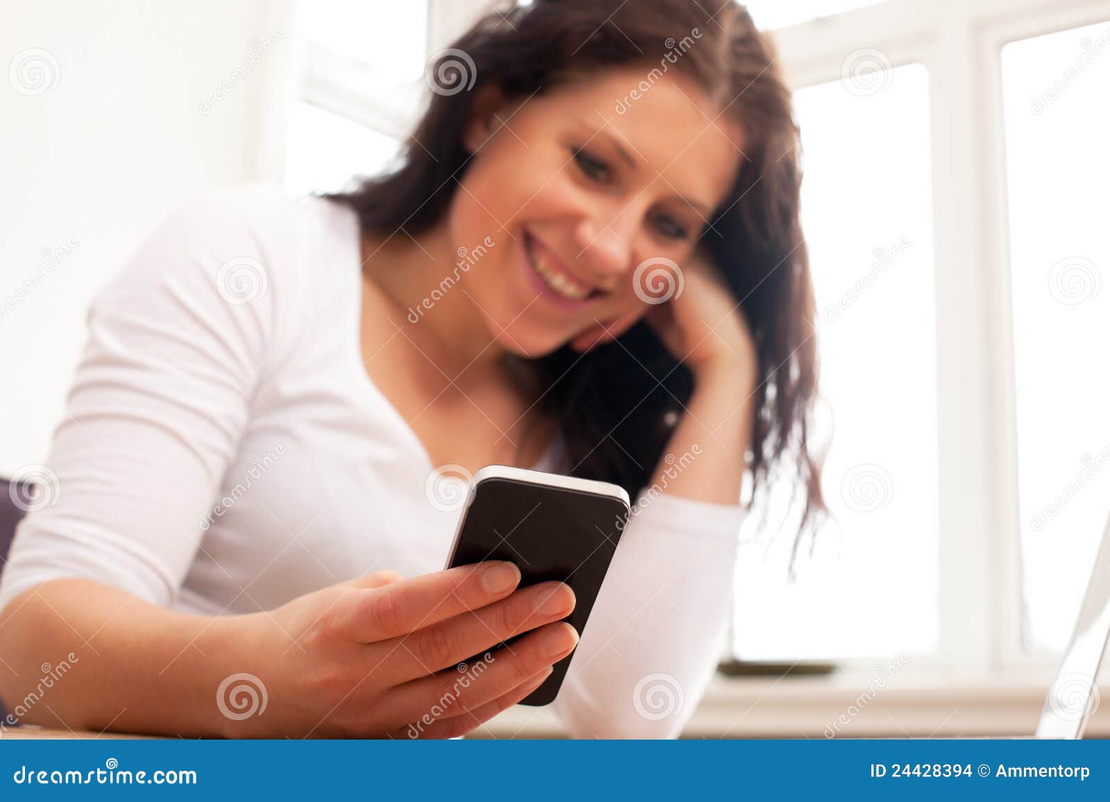 Woman Smiling while Reading Text Message Stock Photo - Image of network ...