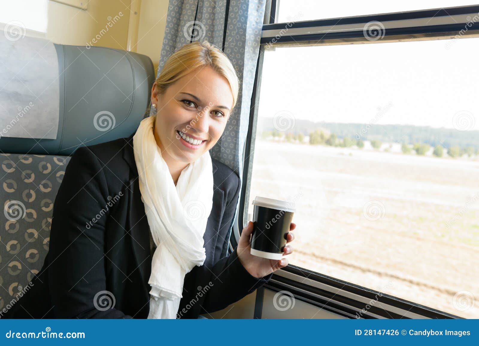 Woman Smiling Sitting in Train Holding Coffee Stock Photo - Image of ...