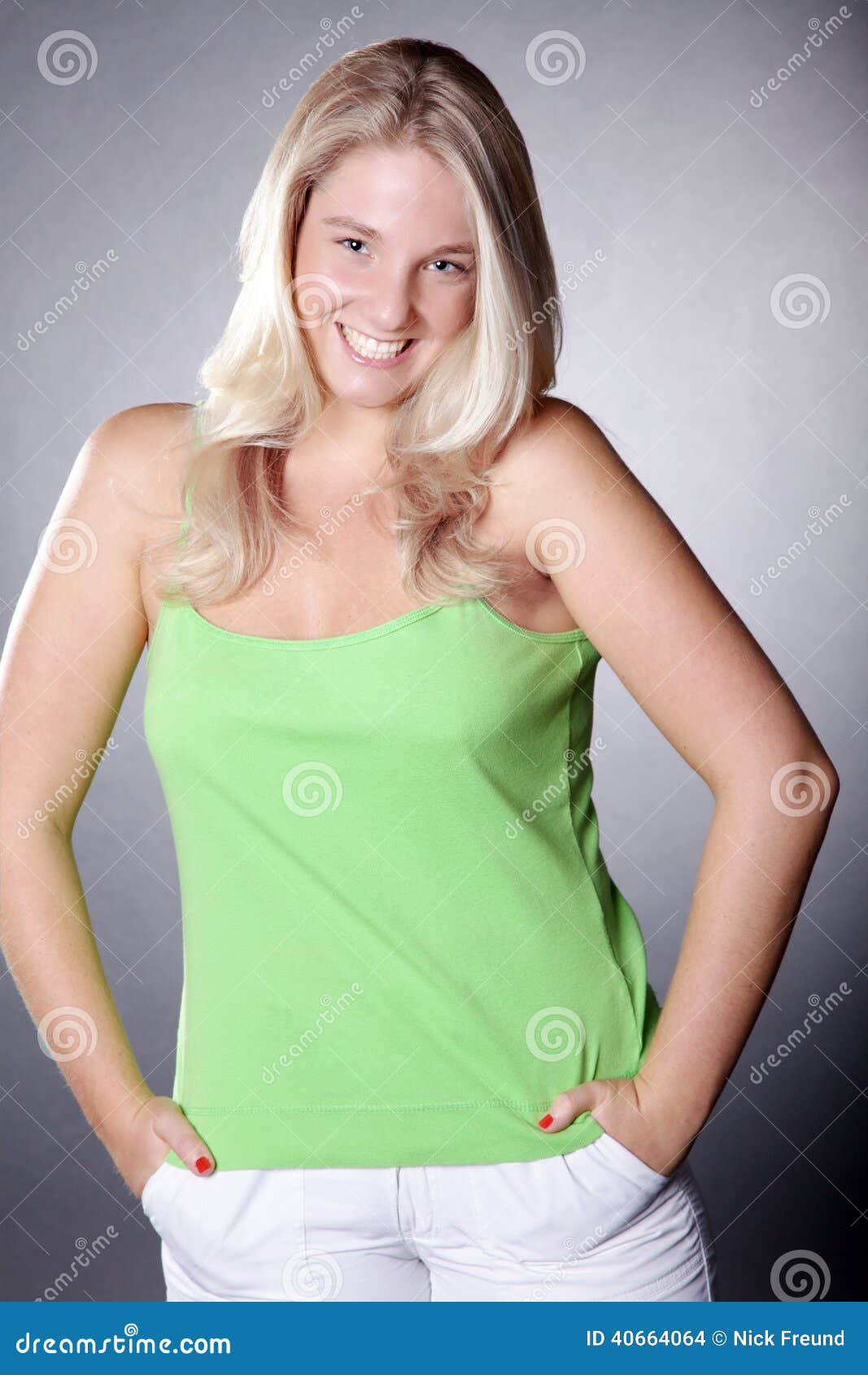 Woman Smiling while Standing Stock Photo - Image of charming, girl ...