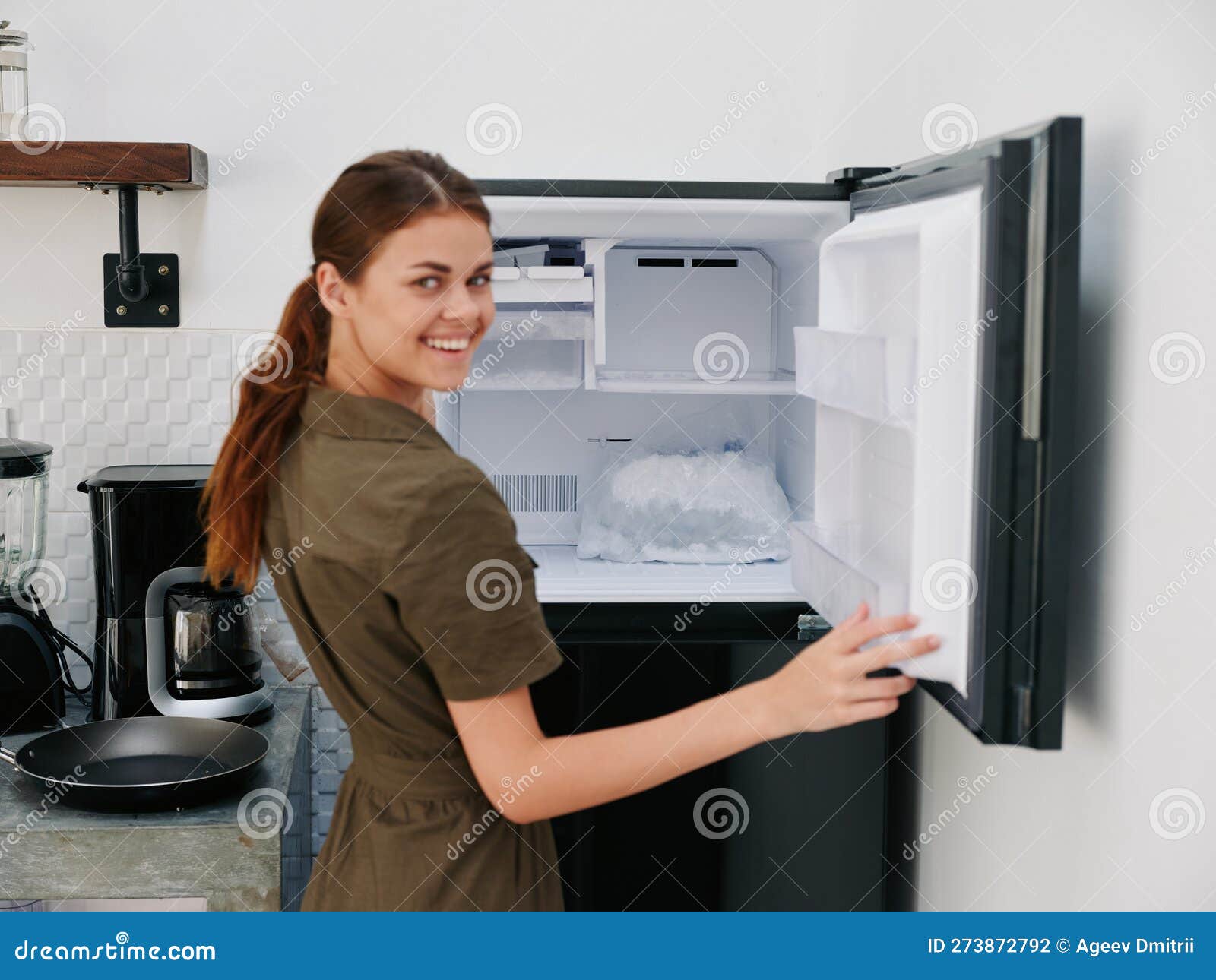 Woman Smiling with Teeth Looking into Camera in Kitchen at Home Opened ...