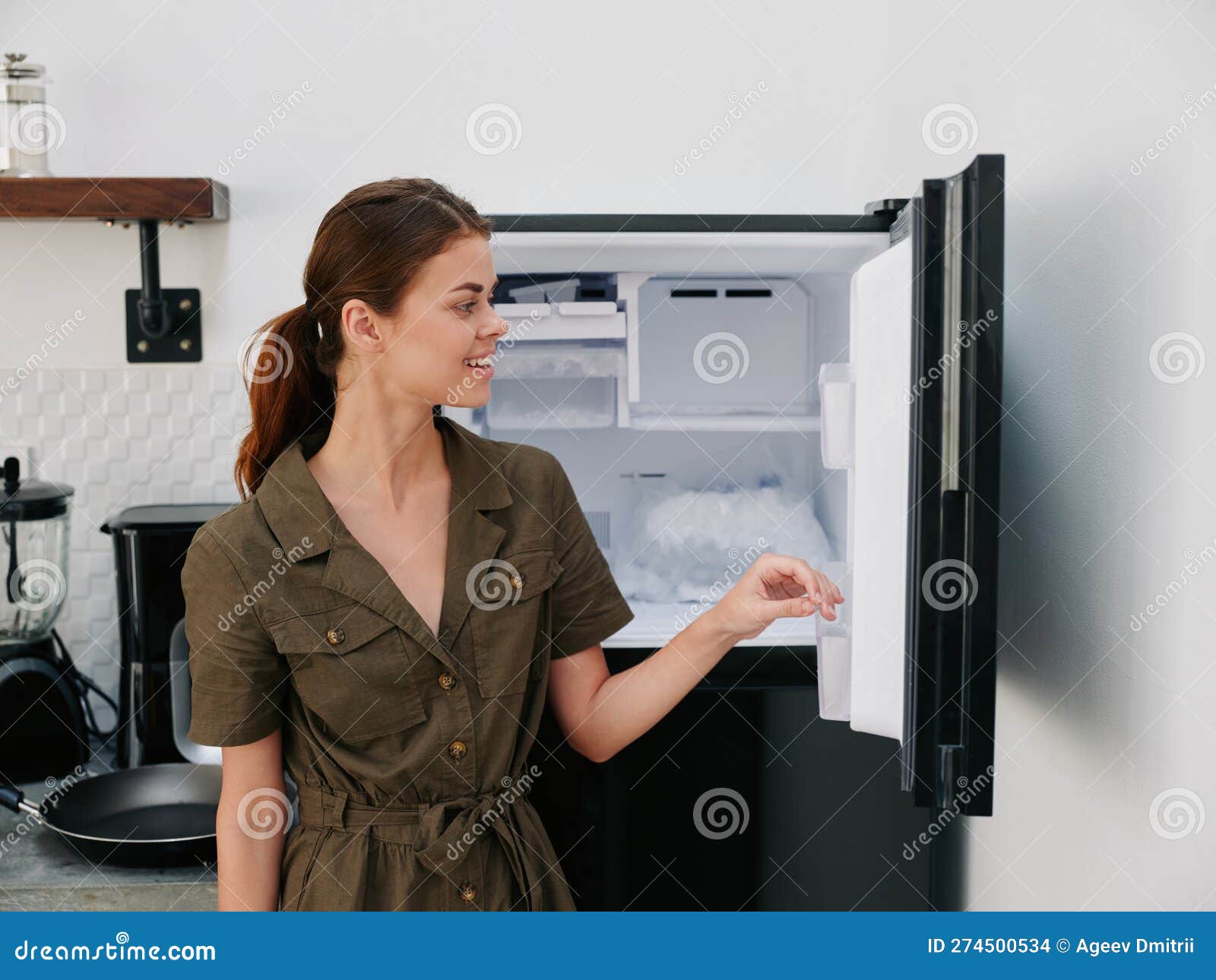 Woman Smiling with Teeth Looking into Camera in Kitchen at Home Opened ...