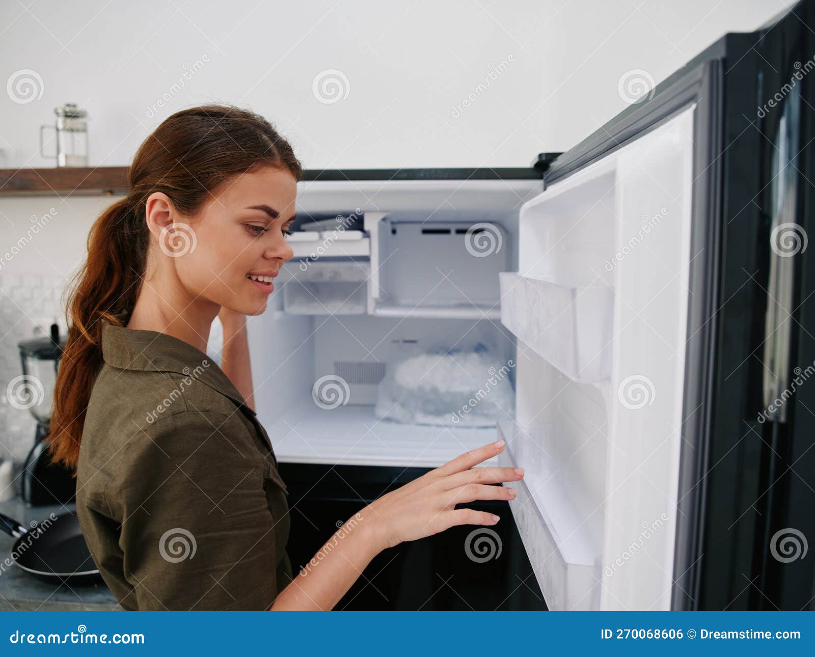 Woman Smiling with Teeth Looking into Camera in Kitchen at Home Opened ...