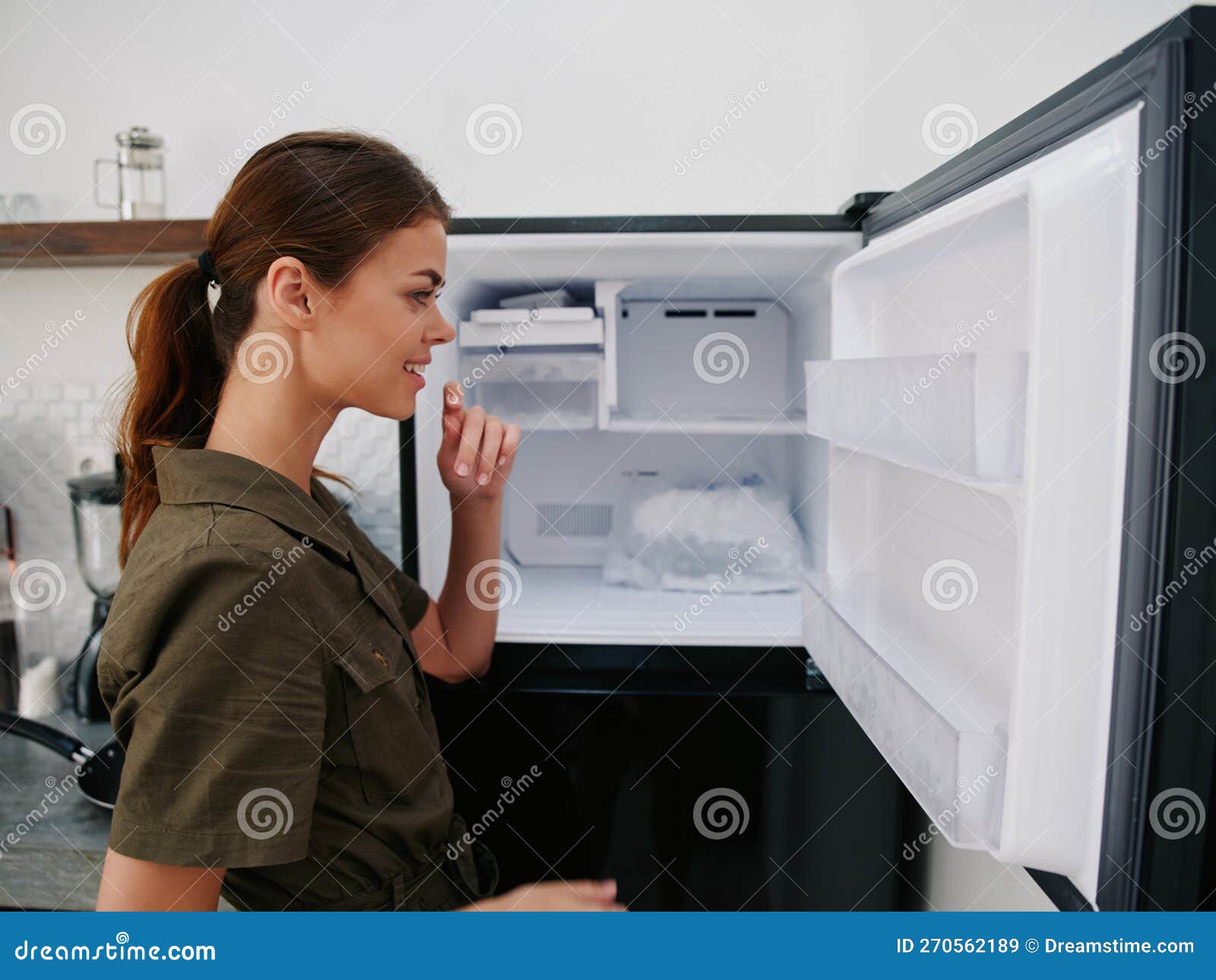 Woman Smiling with Teeth Looking into Camera in Kitchen at Home Opened ...