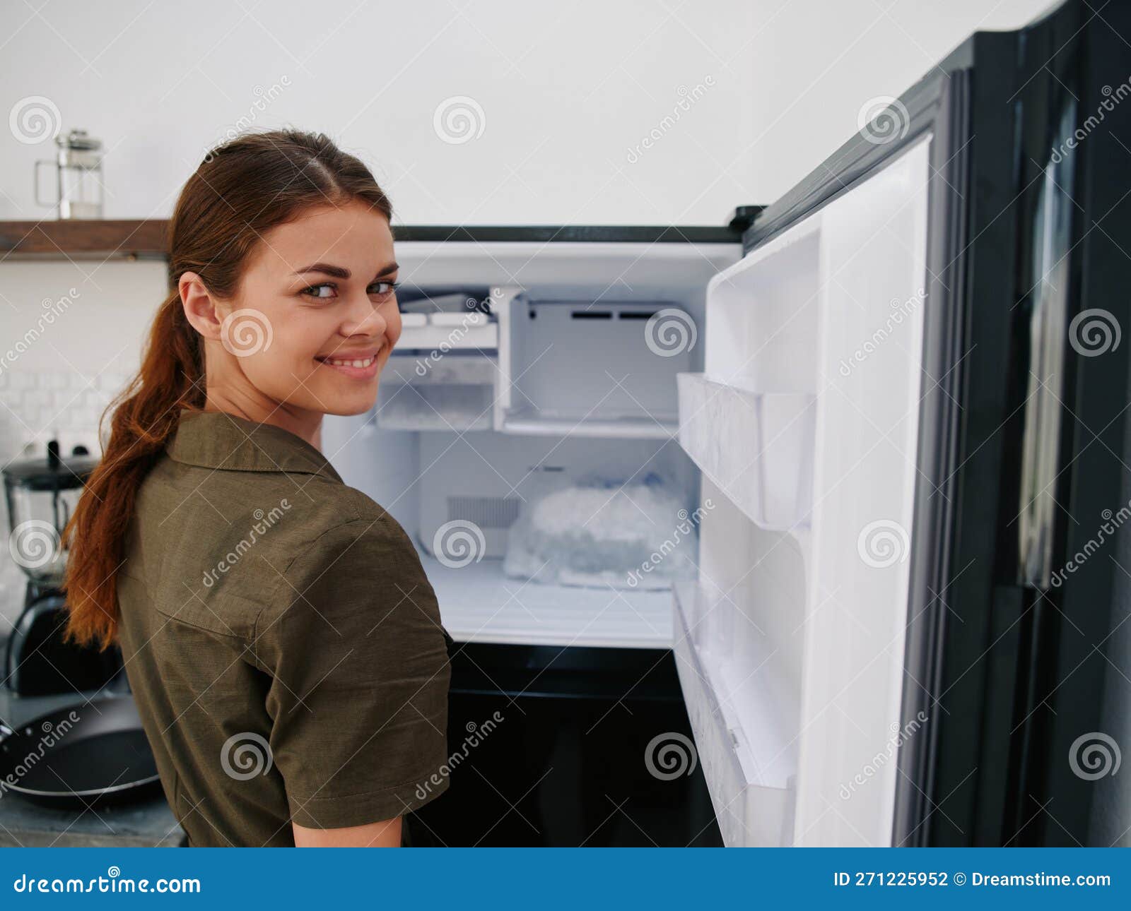 Woman Smiling with Teeth Looking into Camera in Kitchen at Home Opened ...