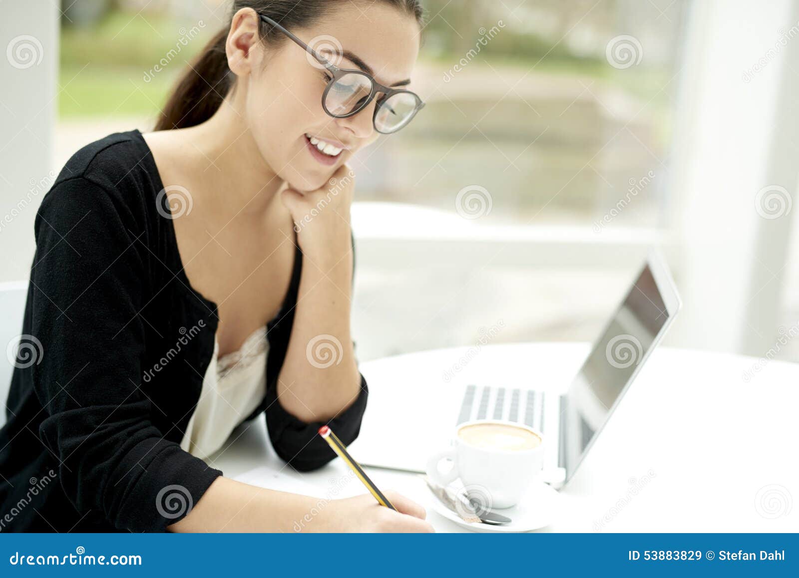 Woman Smiling and Writing in Notepad Stock Image - Image of attractive ...