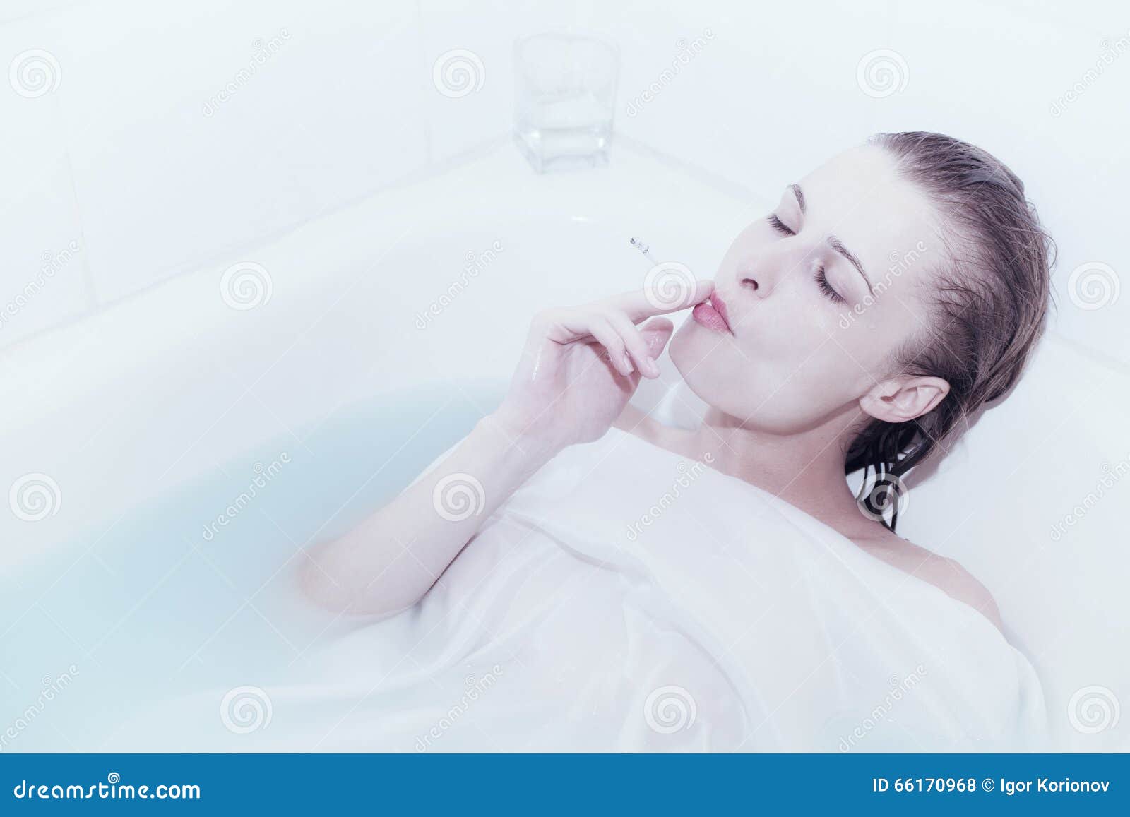 Woman smoking in bathtub stock photo. Image of home, indoors - 66170968