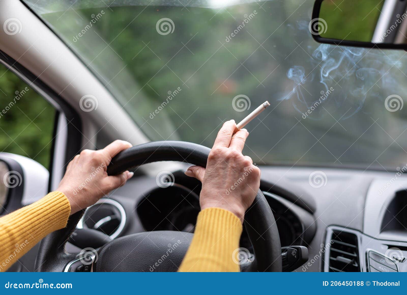 Smoking while driving stock photo. Image of transport - 206450188