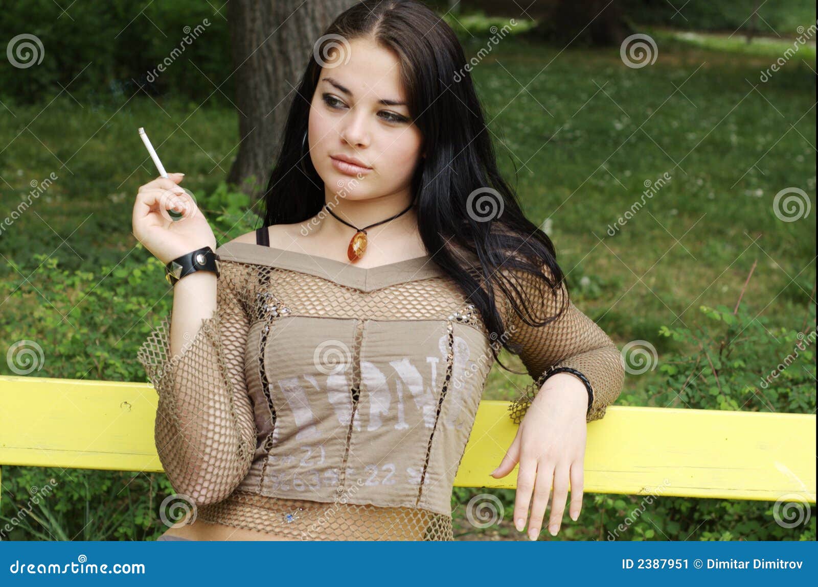 Woman smoking park bench stock image. Image of seated - 2387951