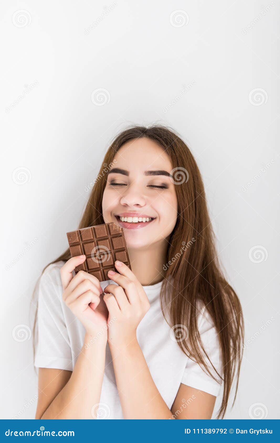 Young Woman Snacking on a Bar of Chocolate Stock Photo - Image of ...