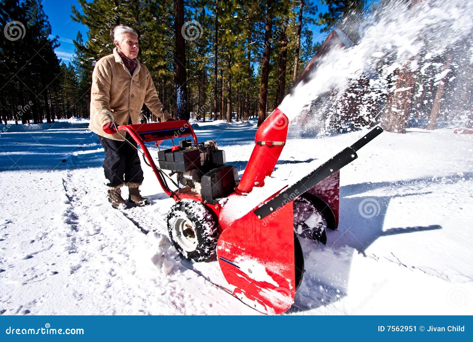 Woman snow blowing stock image. Image of coat, blue, cold - 7562951