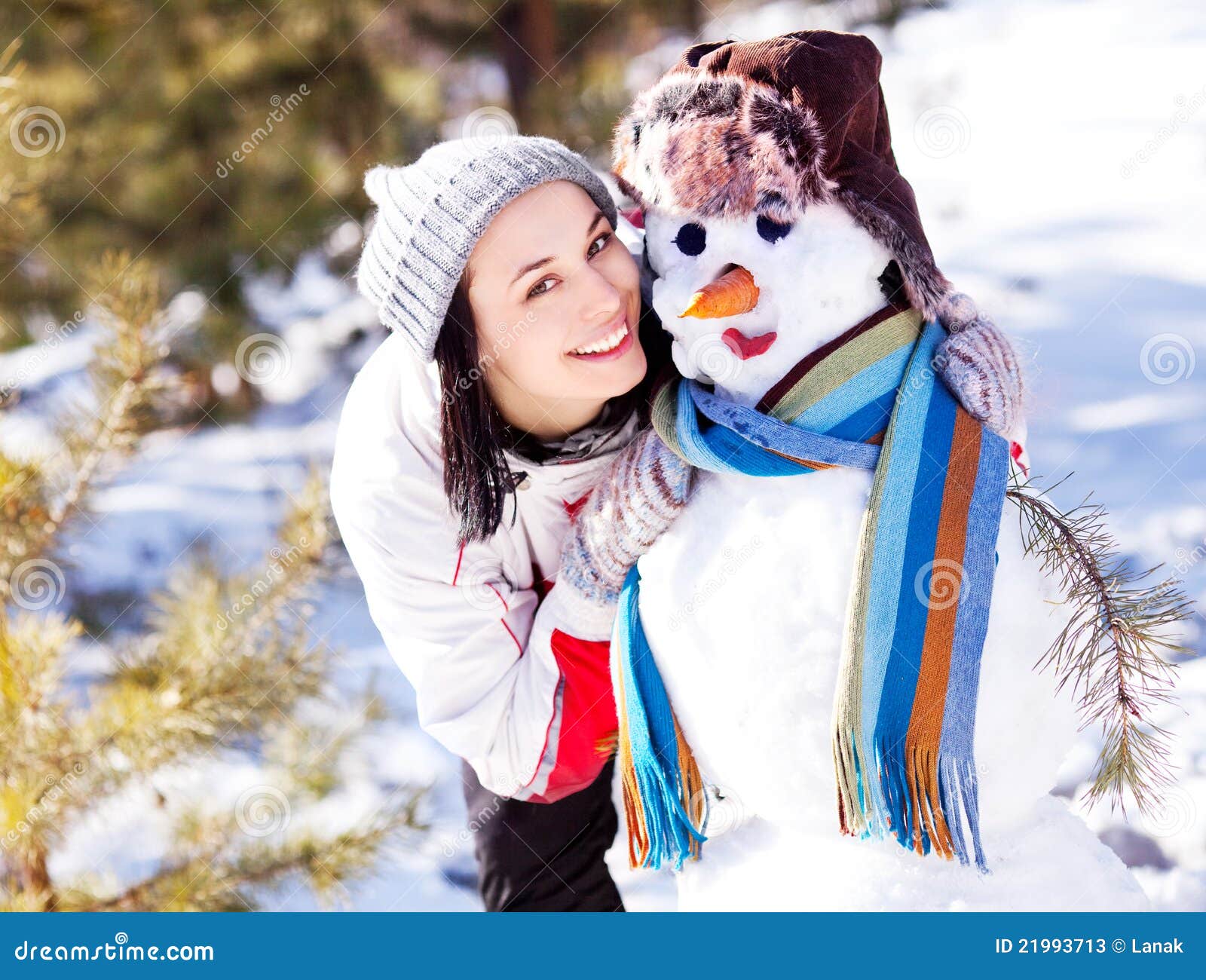 Woman with a snowman stock image. Image of outsides, emotion - 21993713