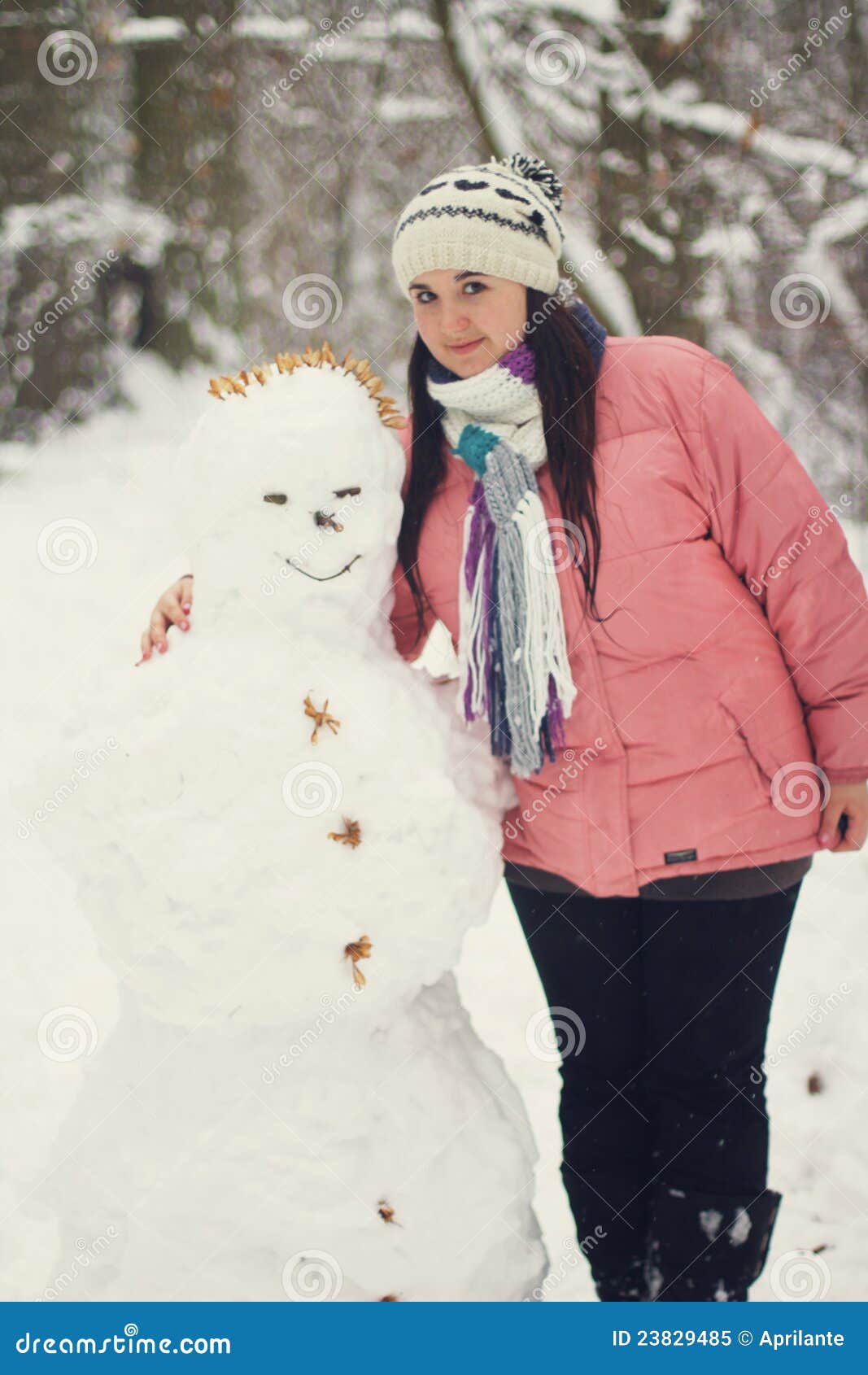 Woman and a snowman stock image. Image of purity, december - 23829485