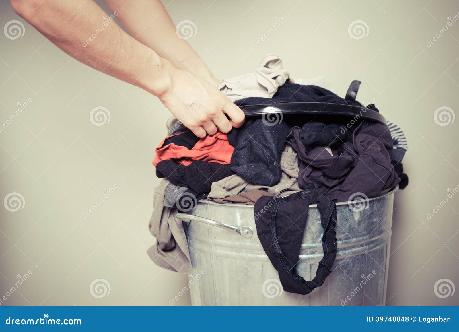 Woman Sorting Out Her Laundry Stock Photo - Image of creased, colorful ...