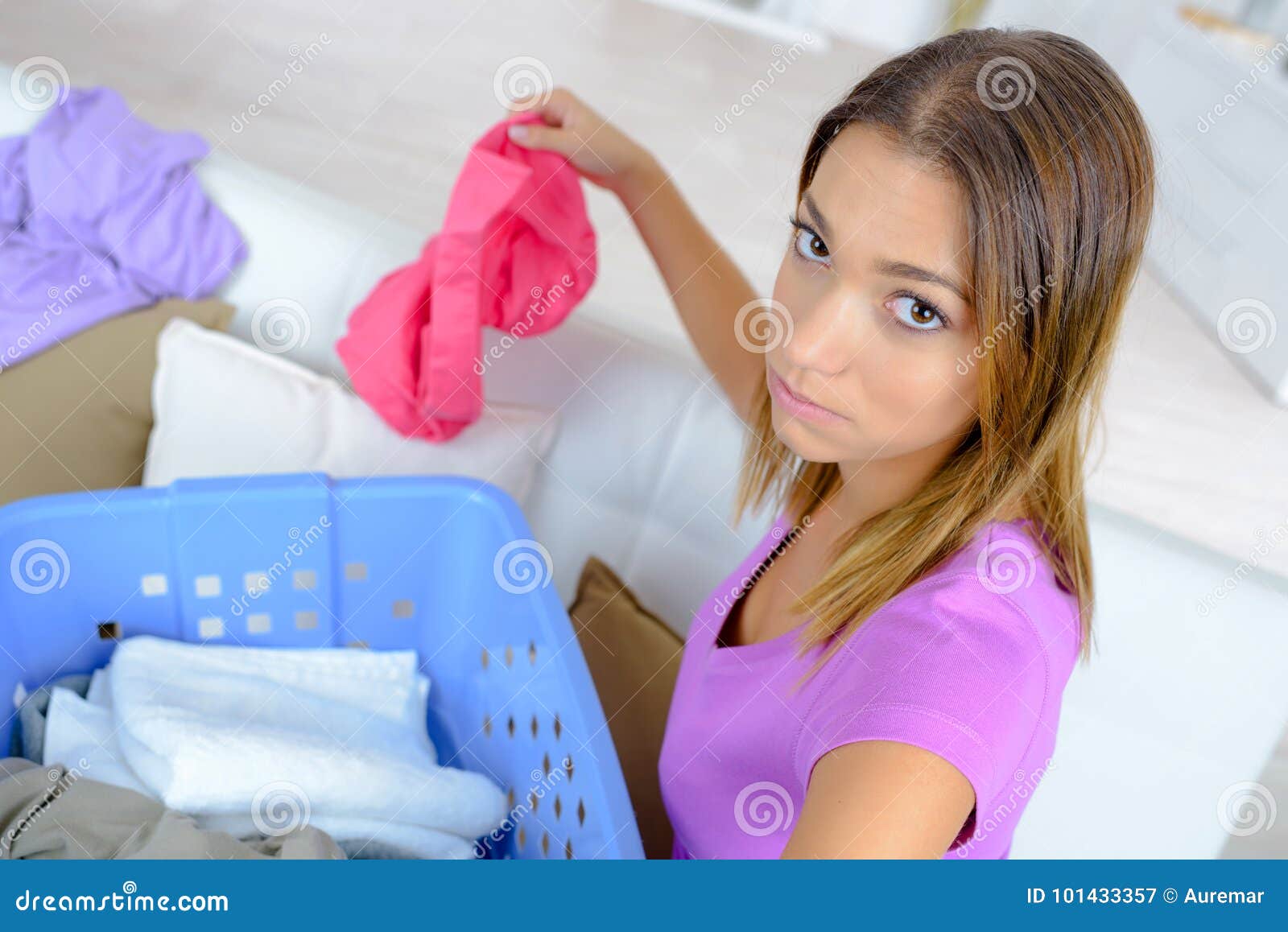 Woman sorting out laundry stock image. Image of duties - 101433357