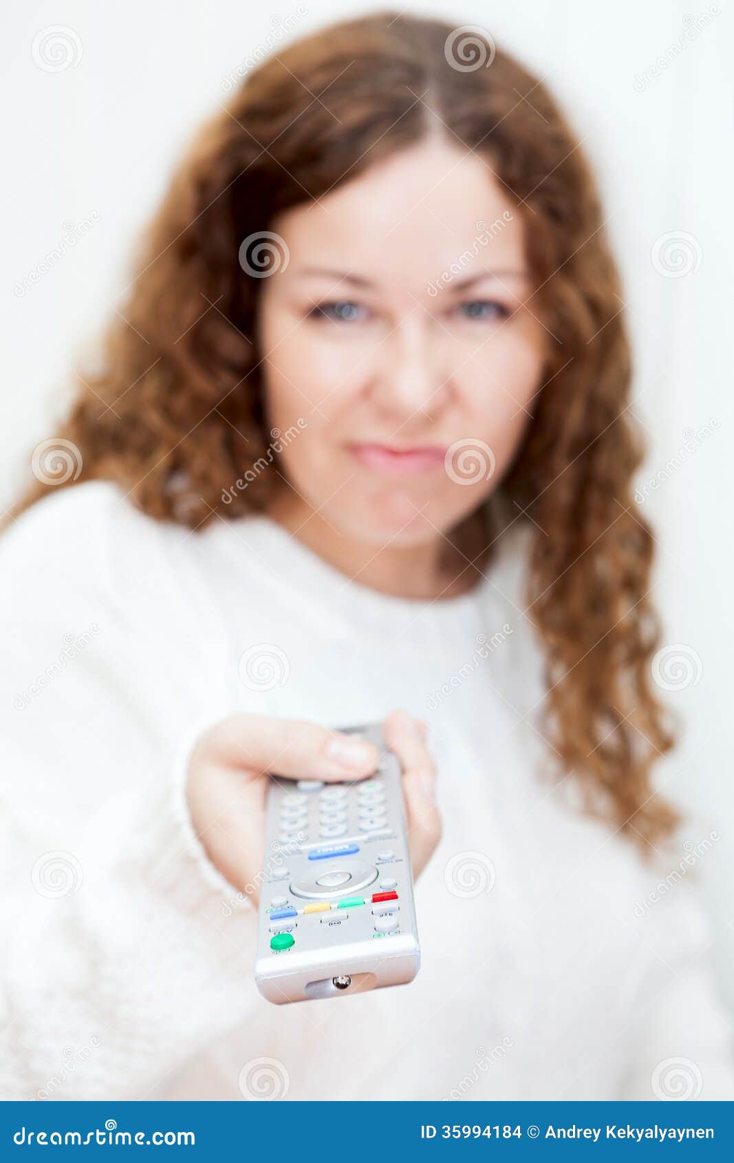 Woman with a Sour Face Changes Channels with Television Remote Stock ...