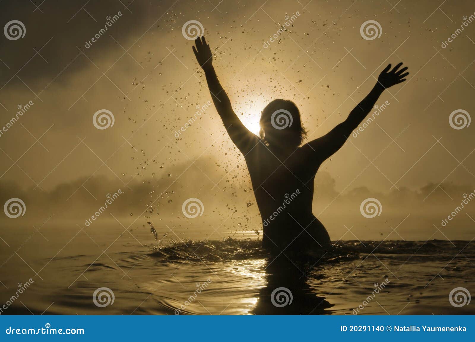 Woman splashing in water stock photo. Image of energy - 20291140