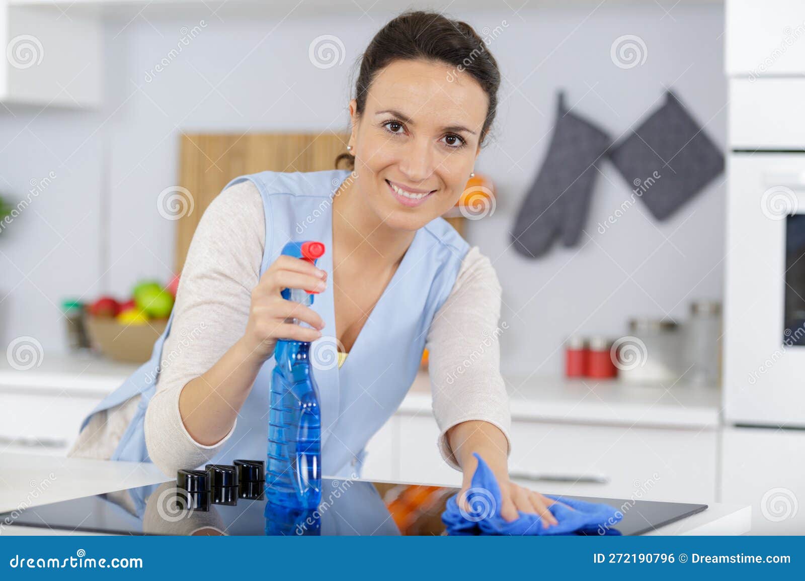 Woman Spraying Houshold Cleaner on Kitchen Counters Stock Photo - Image ...