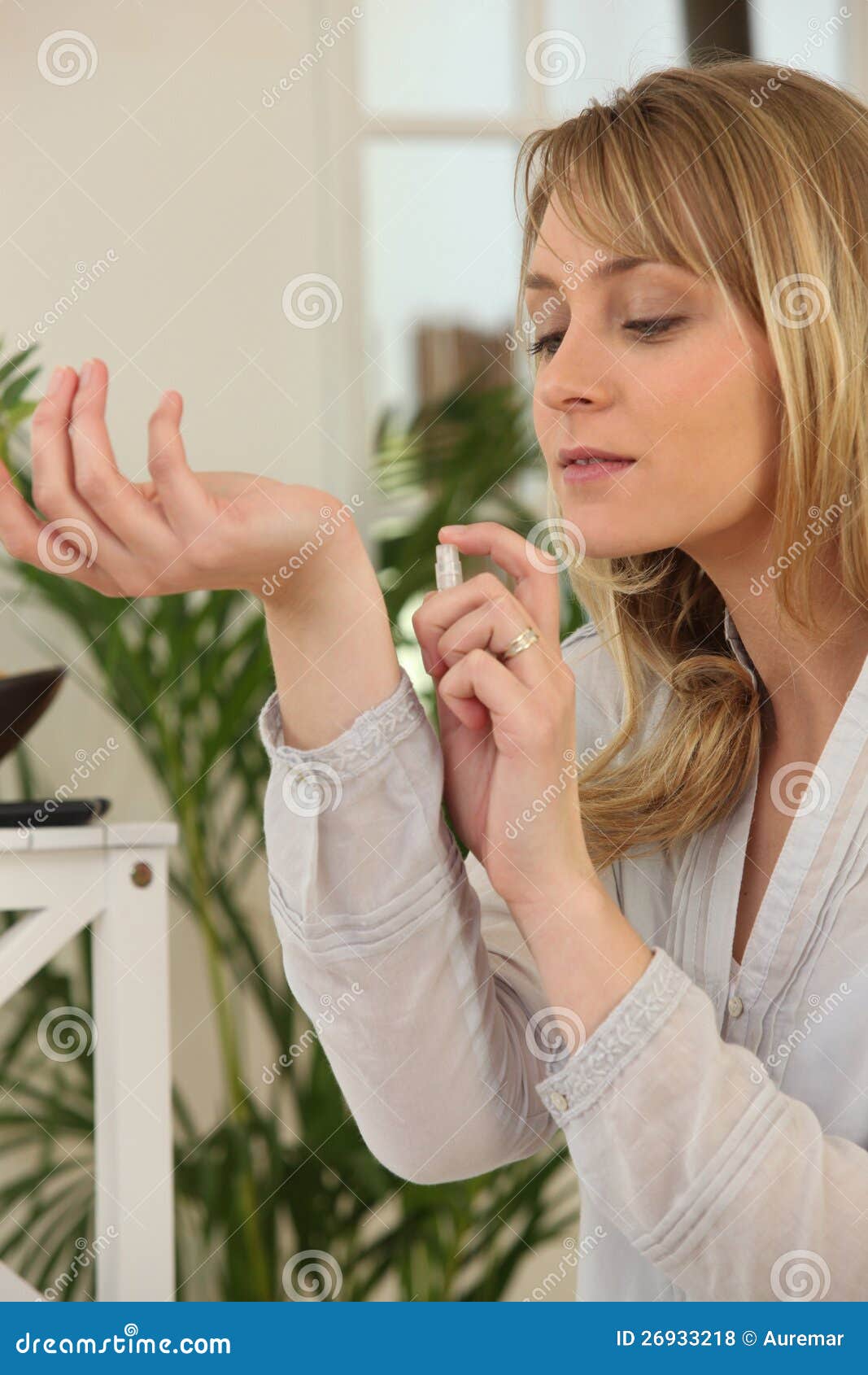 Woman spraying perfume stock photo. Image of beauty, pleased - 26933218