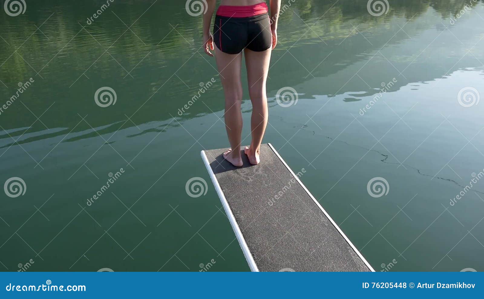 Woman on Springboard Preparing To Dive in a Lake Stock Footage - Video ...